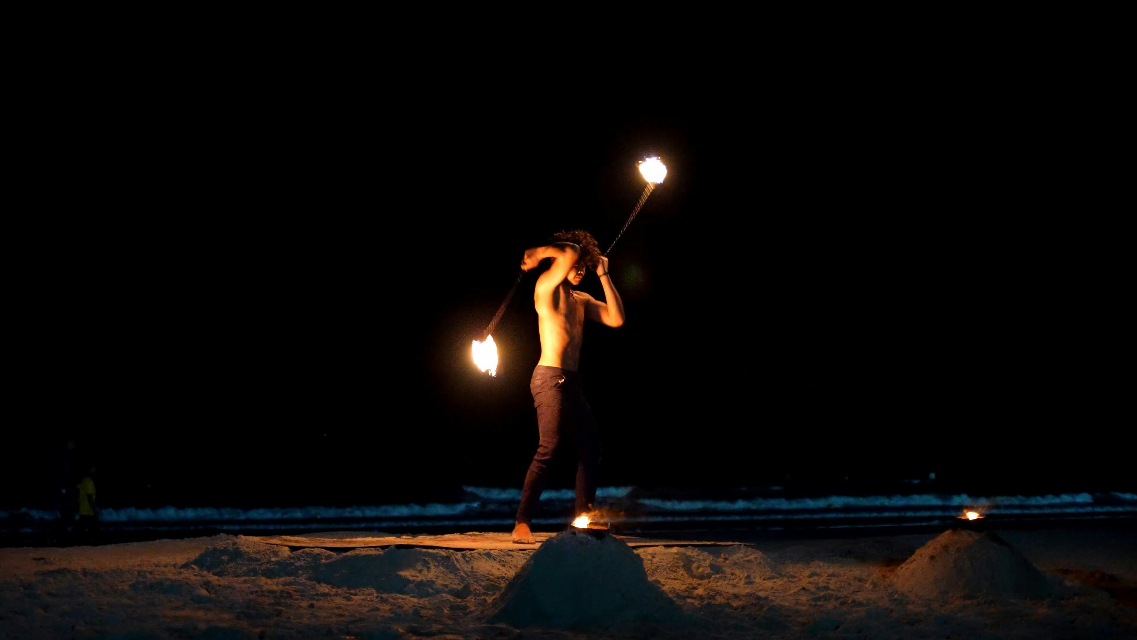 A man is performing fire shows on the beach Free Stock Video Footage ...