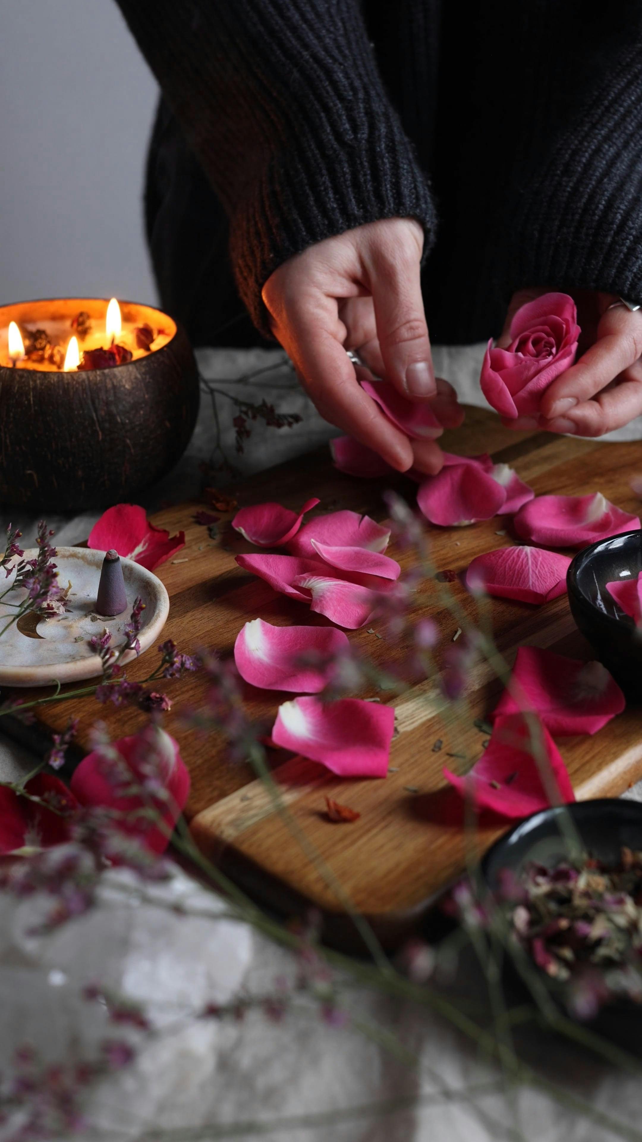 A woman is making a candle with rose petals Free Stock Video Footage ...