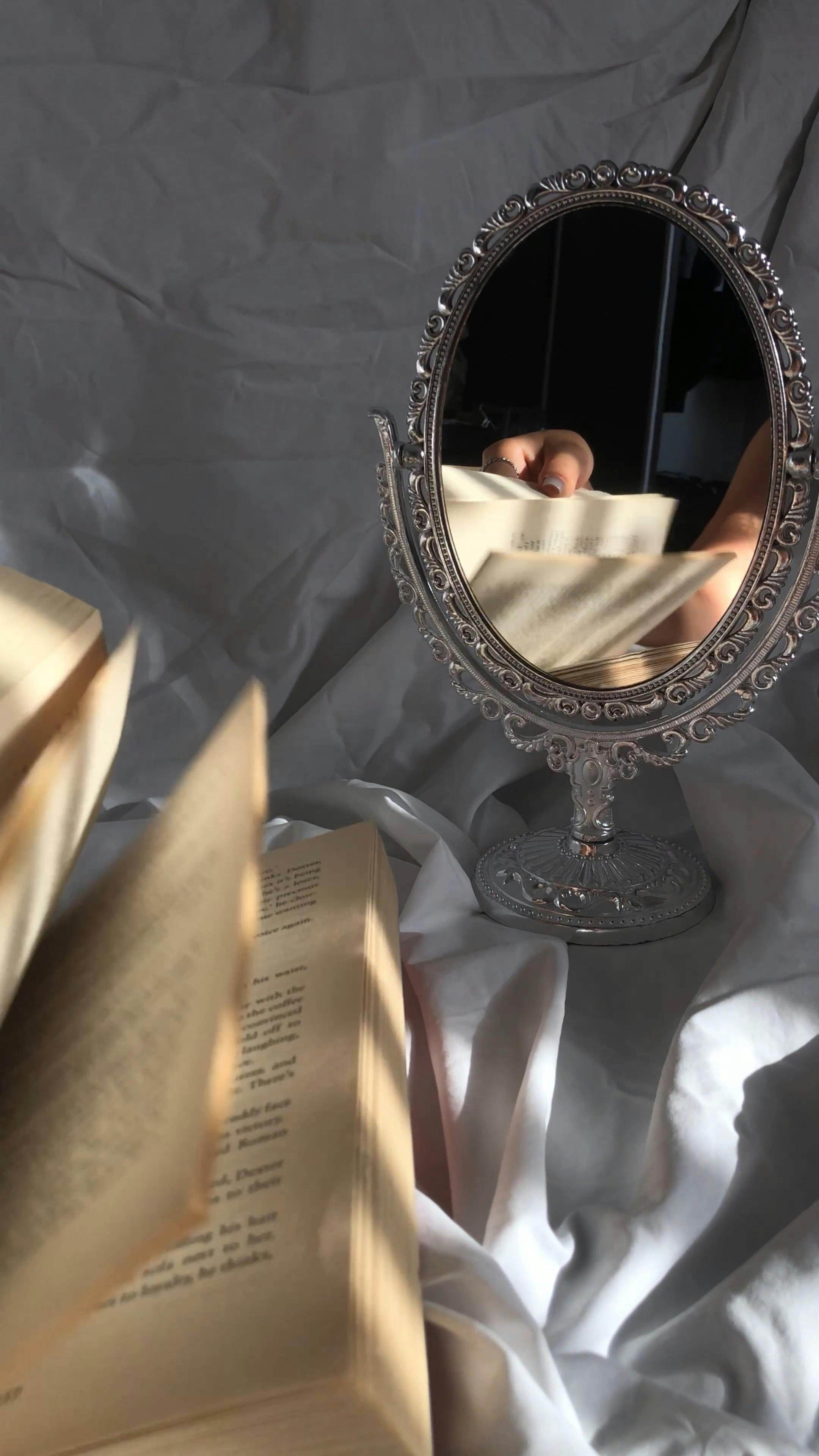 A book with a mirror on top of it Free Stock Video Footage, Royalty ...