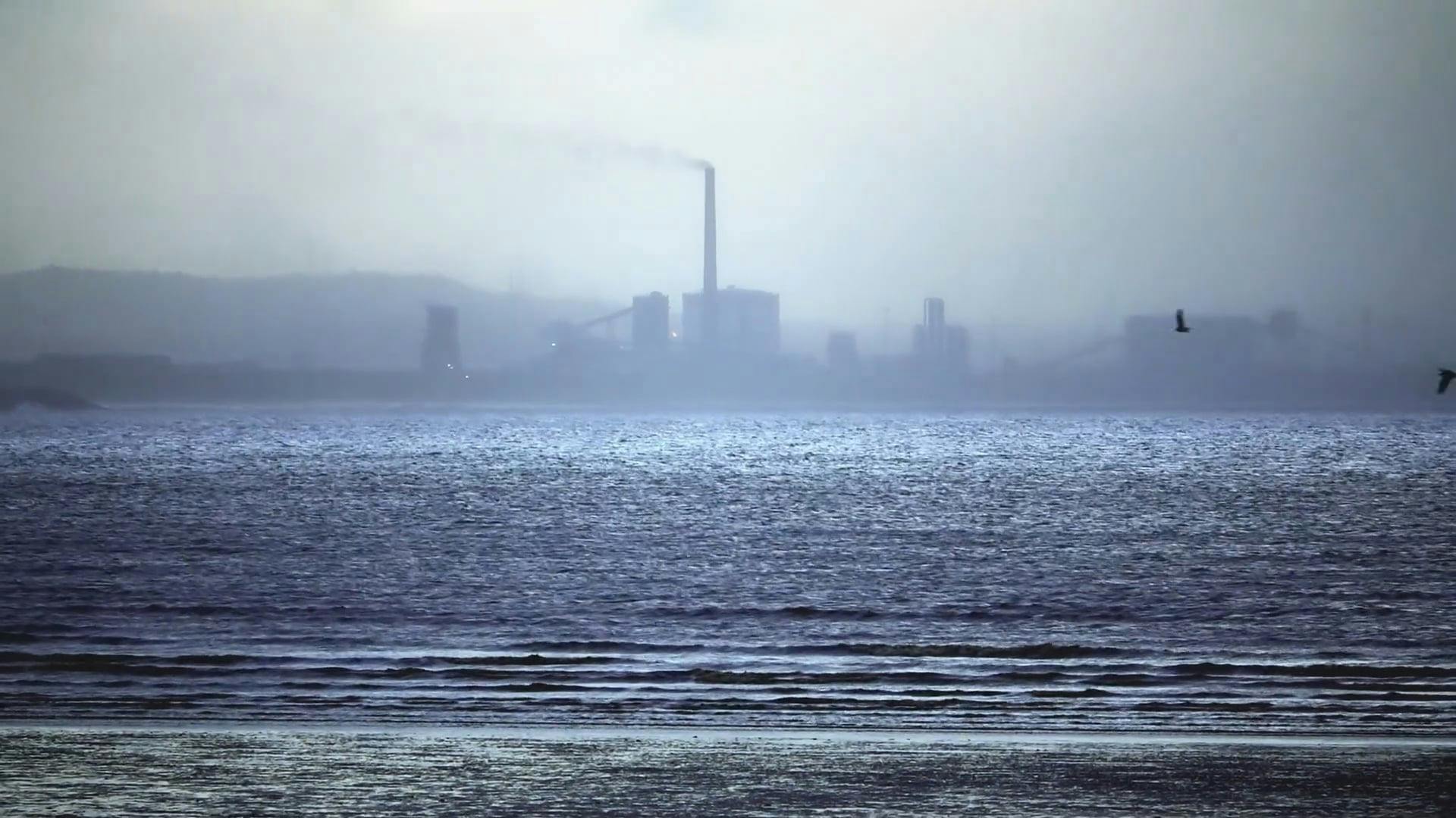 smoggy industrial landscape, seascape. Port Talbot viewed from Swansea ...