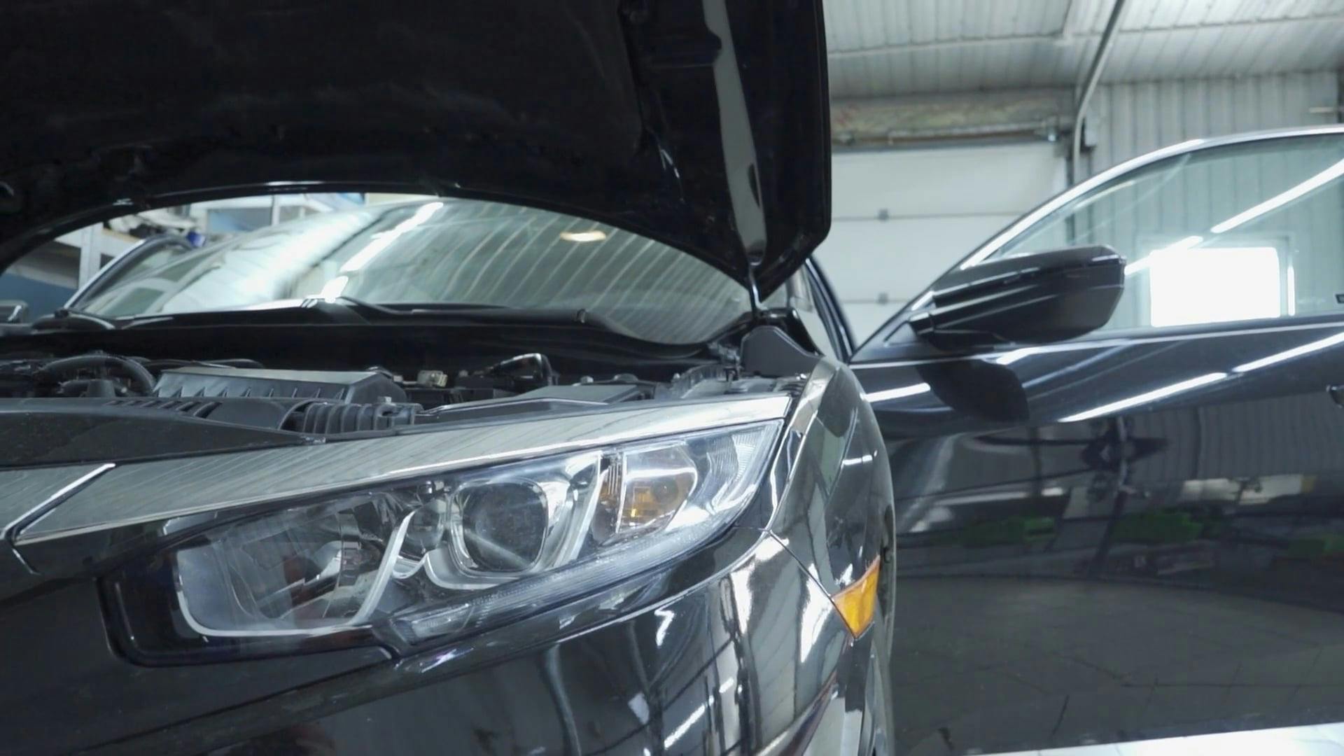 A close up of a black honda car with its hood open Free Stock Video ...