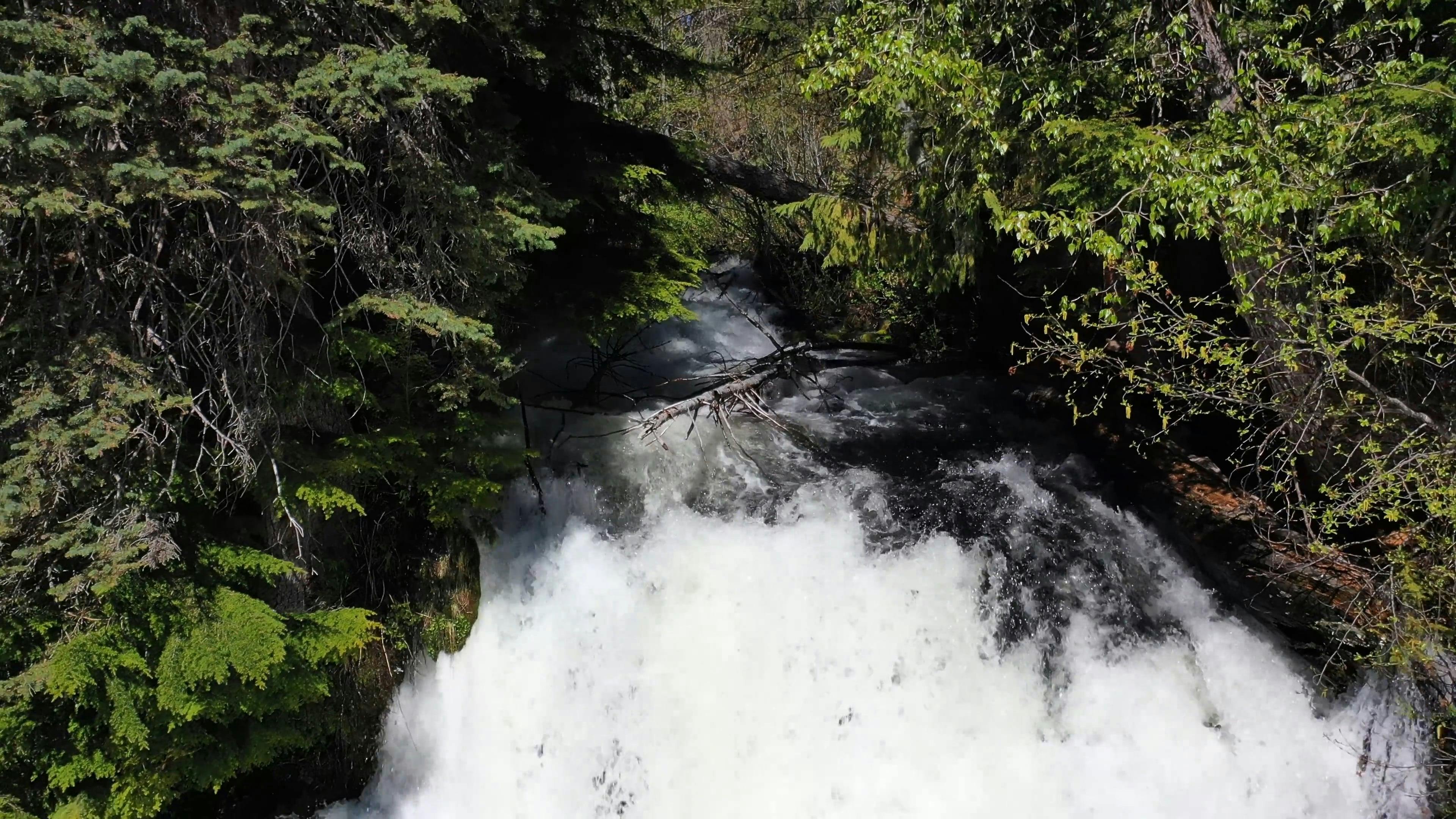 A waterfall is shown in this aerial photo Free Stock Video Footage, Royalty-Free 4K & HD Video Clip