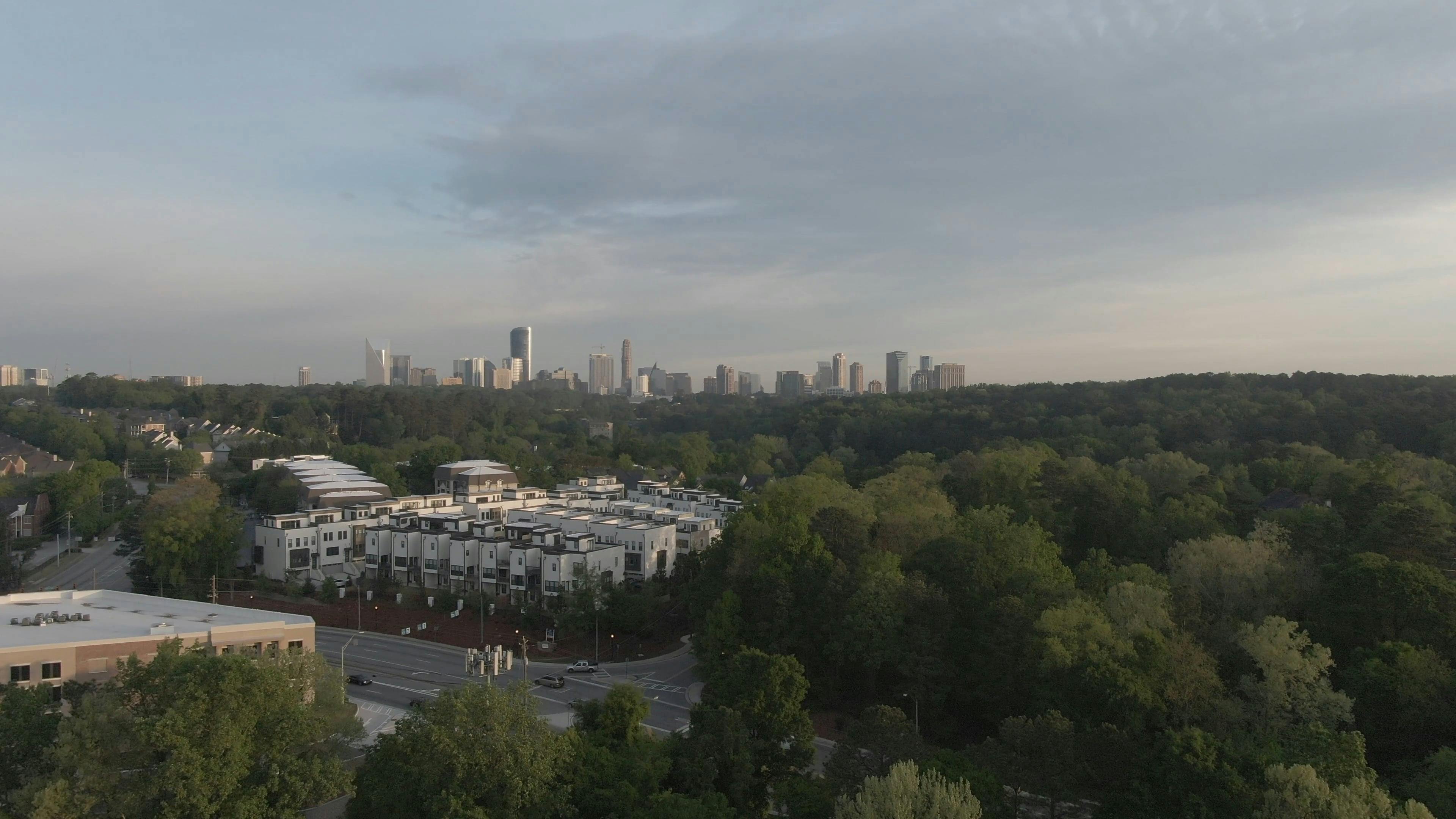Buildings And Houses In The Woods With View Of City · Free Stock Video