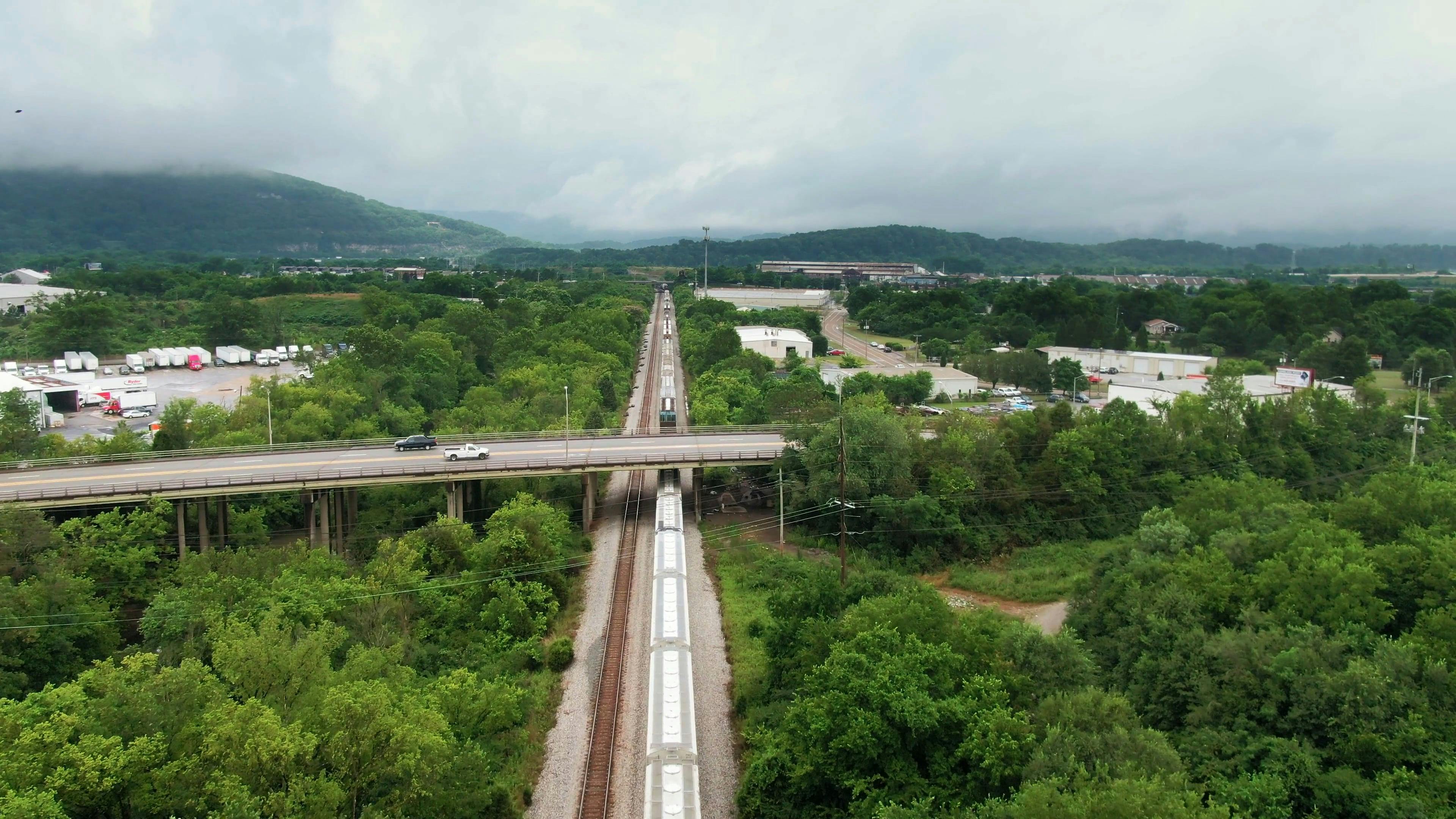 A Train Passing Under An Elevated Highway Free Stock Video Footage ...