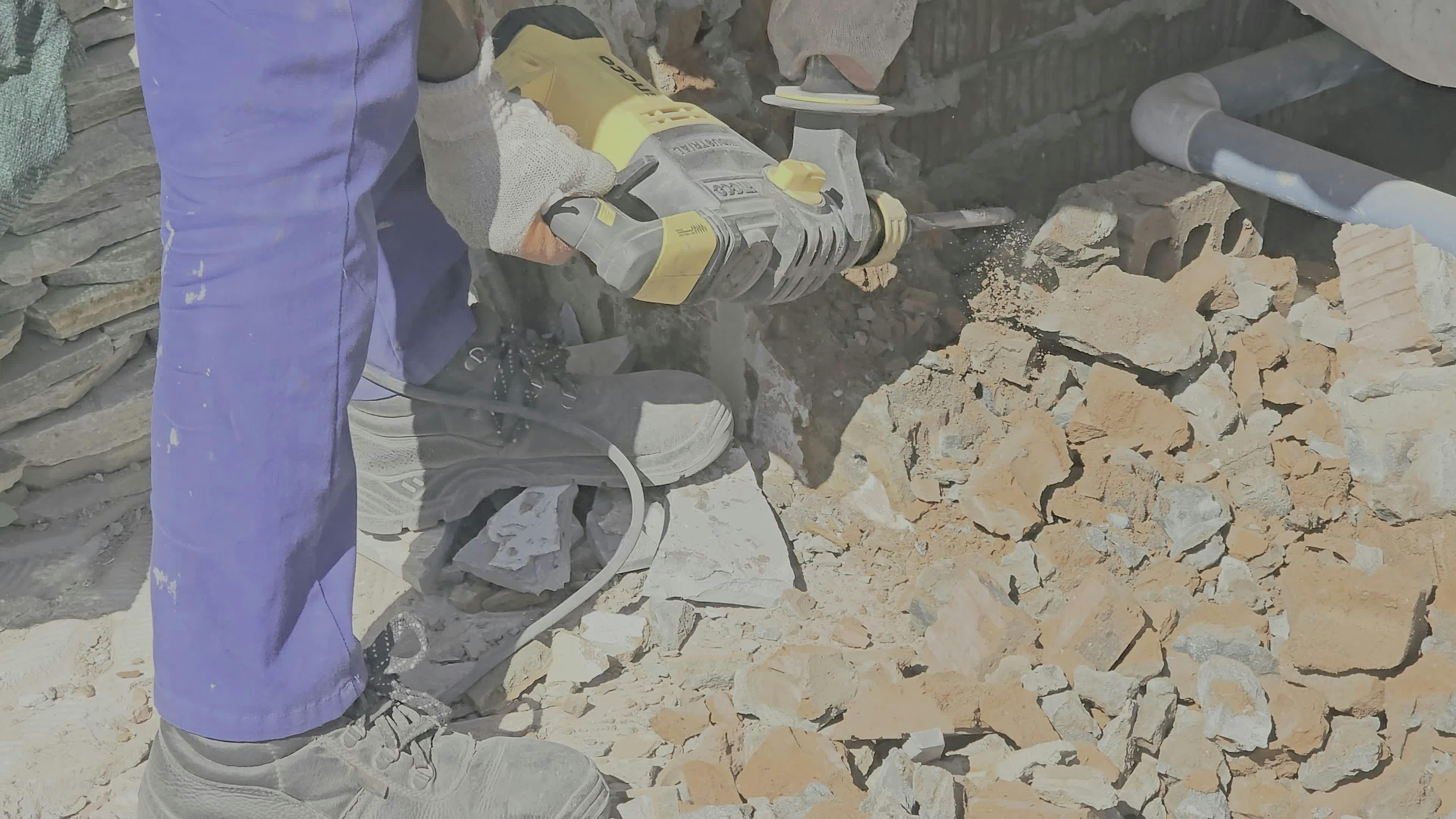 A man is using a power tool to remove rubble Free Stock Video Footage ...