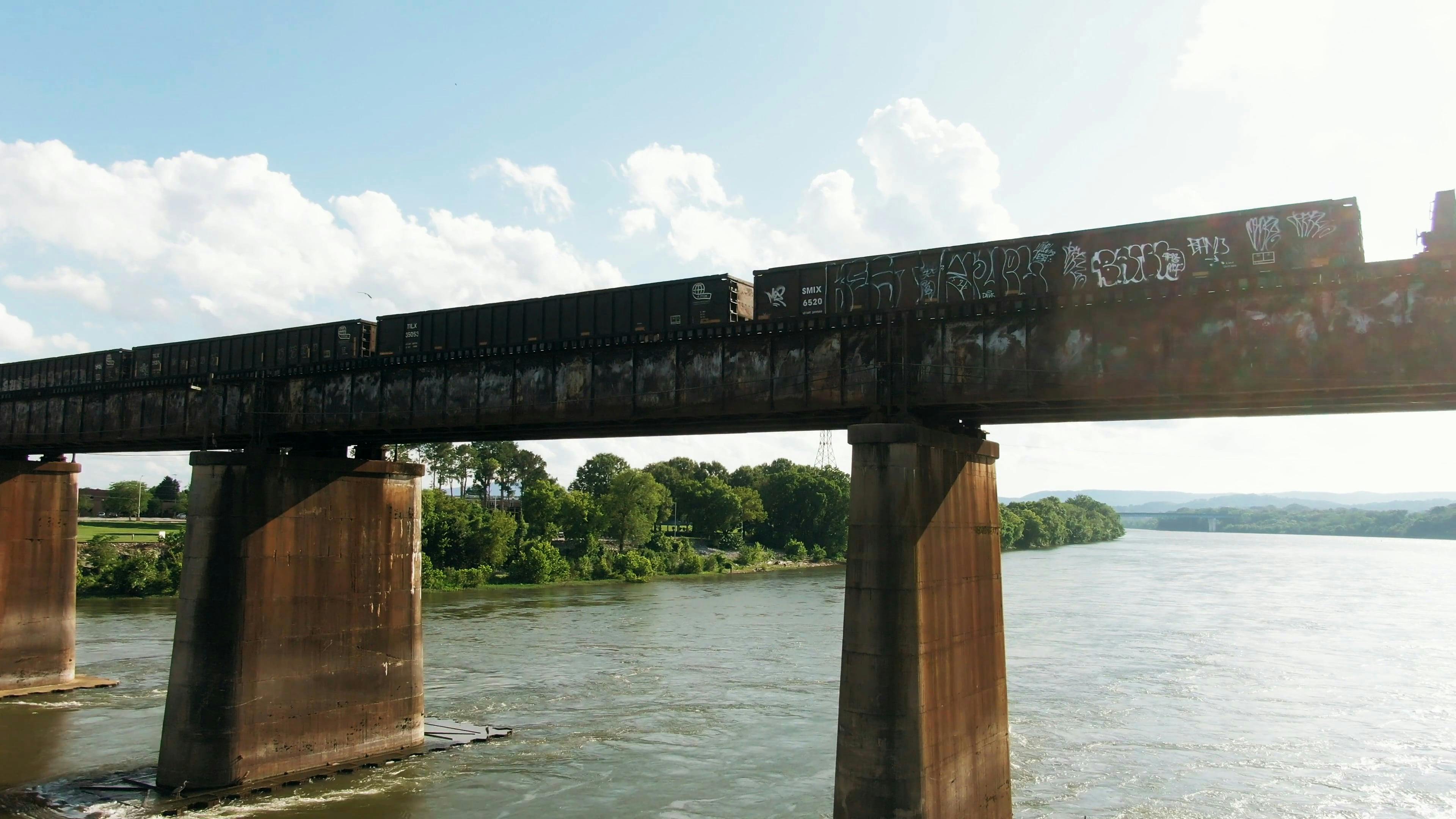 A Train Trams Crossing A Railroad Bridge Over A River · Free Stock Video