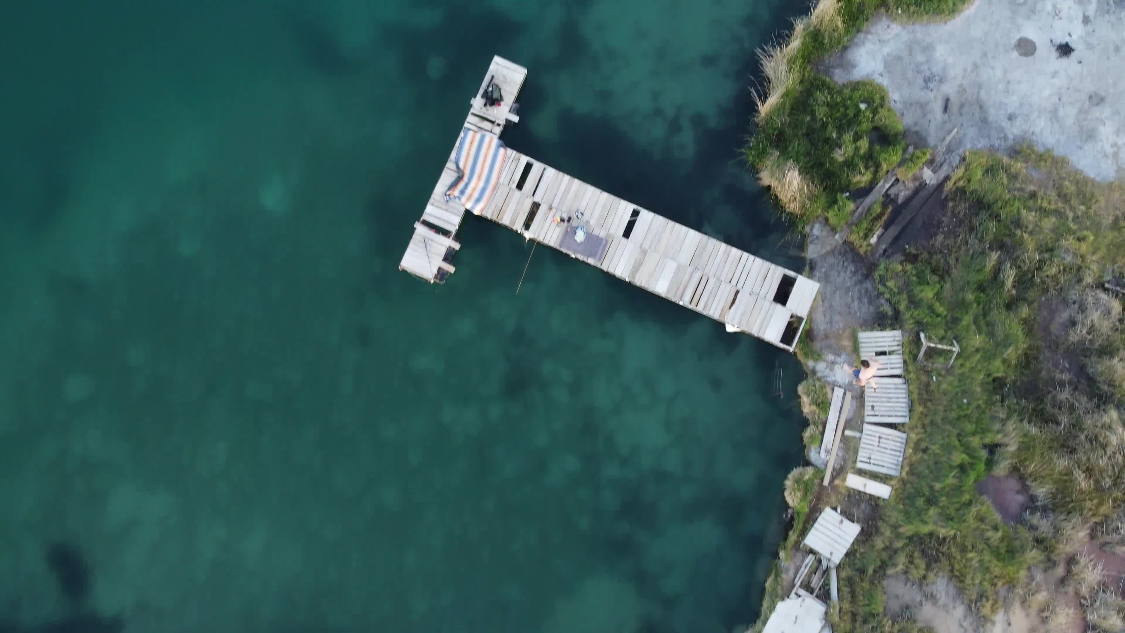An aerial view of a dock in the middle of a body of water Free Stock ...