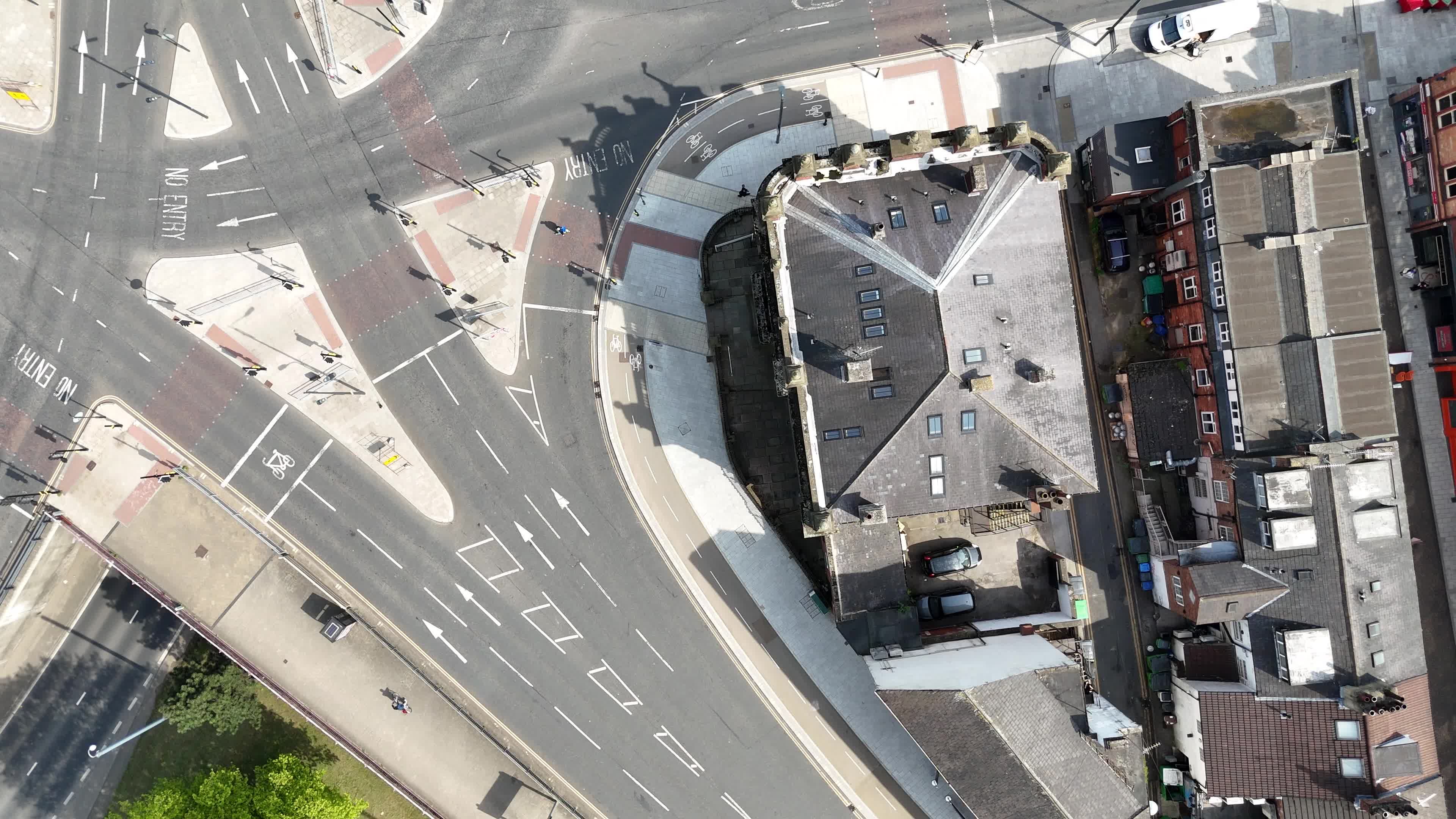 An aerial view of a city street with cars and buildings Free Stock ...