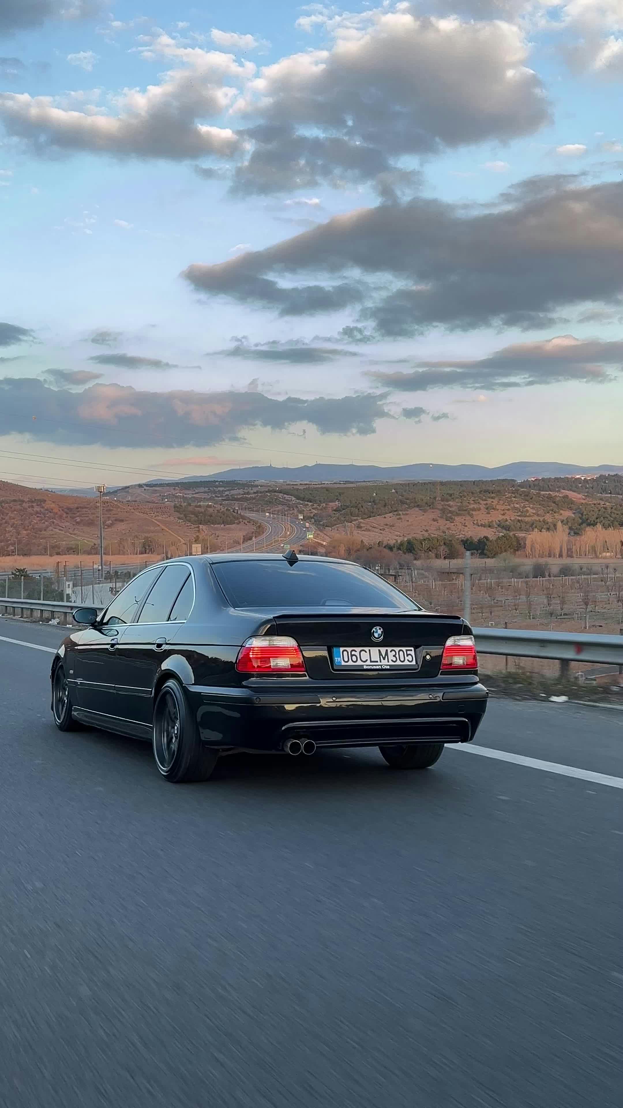 A black bmw car driving down the road Free Stock Video Footage, Royalty ...