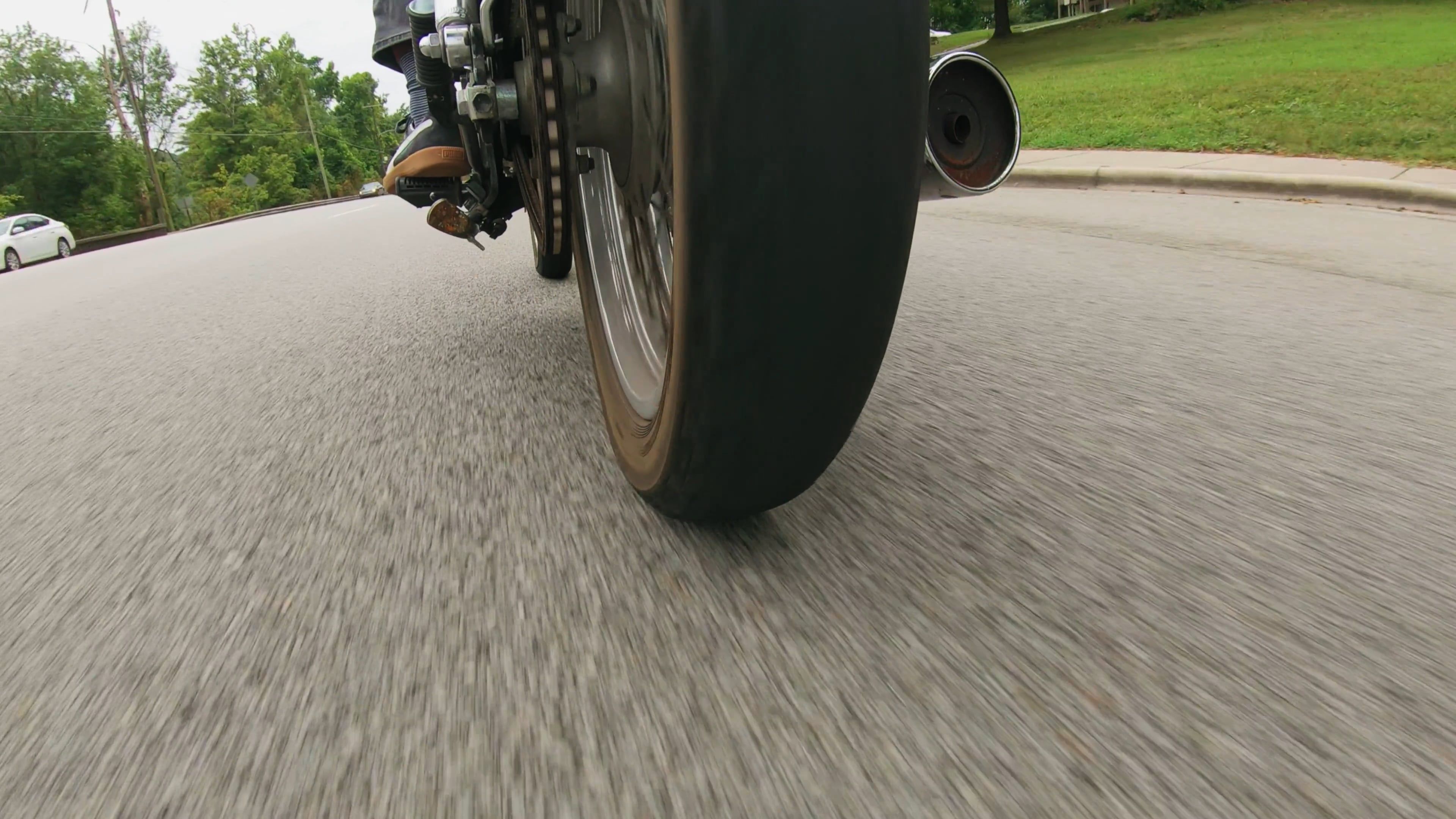 A Motorcycle Rider Travels On A Concrete Road · Free Stock Video