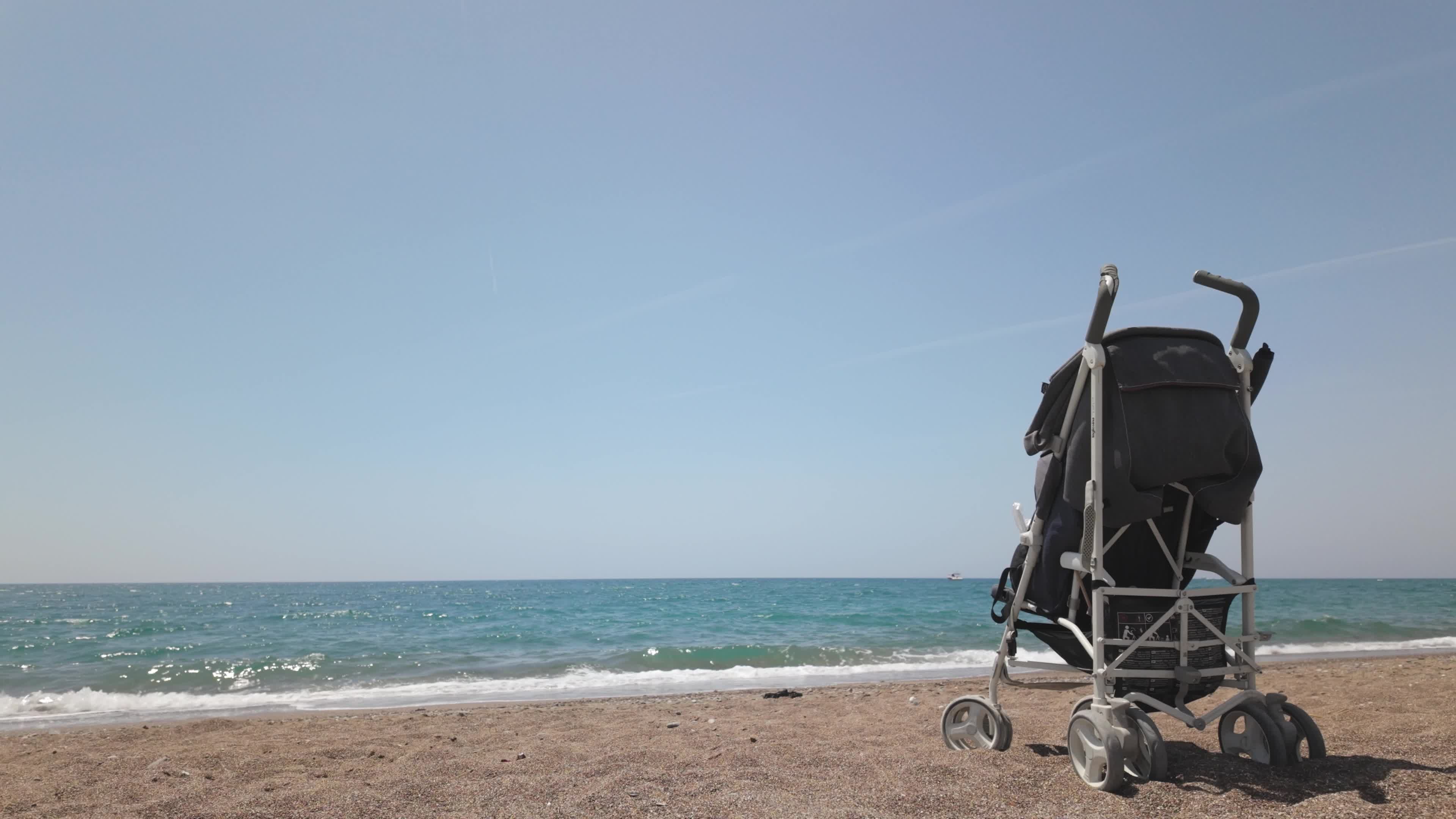 a baby stroller on the beach Free Stock Video Footage, Royalty-Free 4K ...