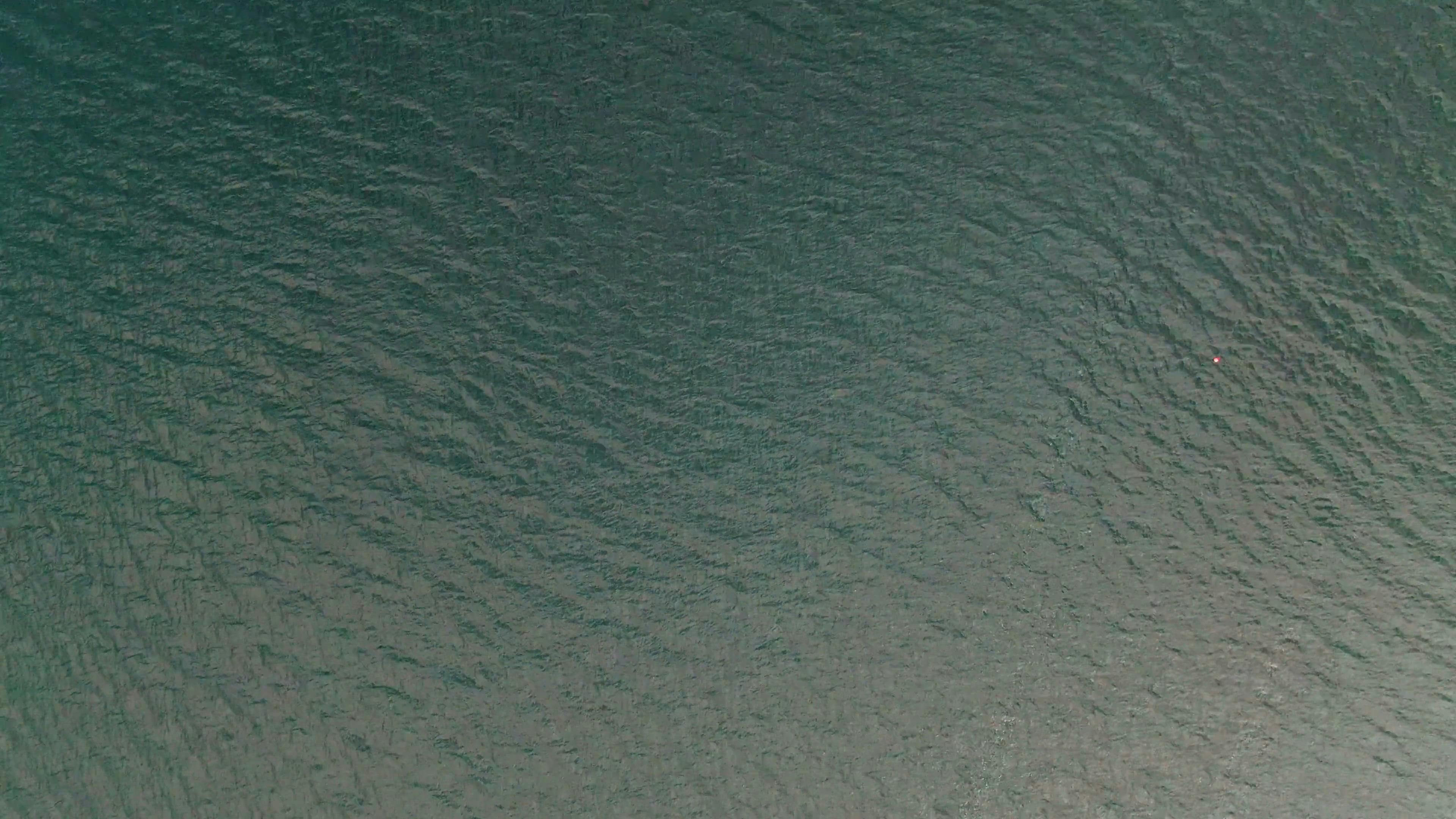 Drone Footage Of Surface Of A Body Of Water · Free Stock Video