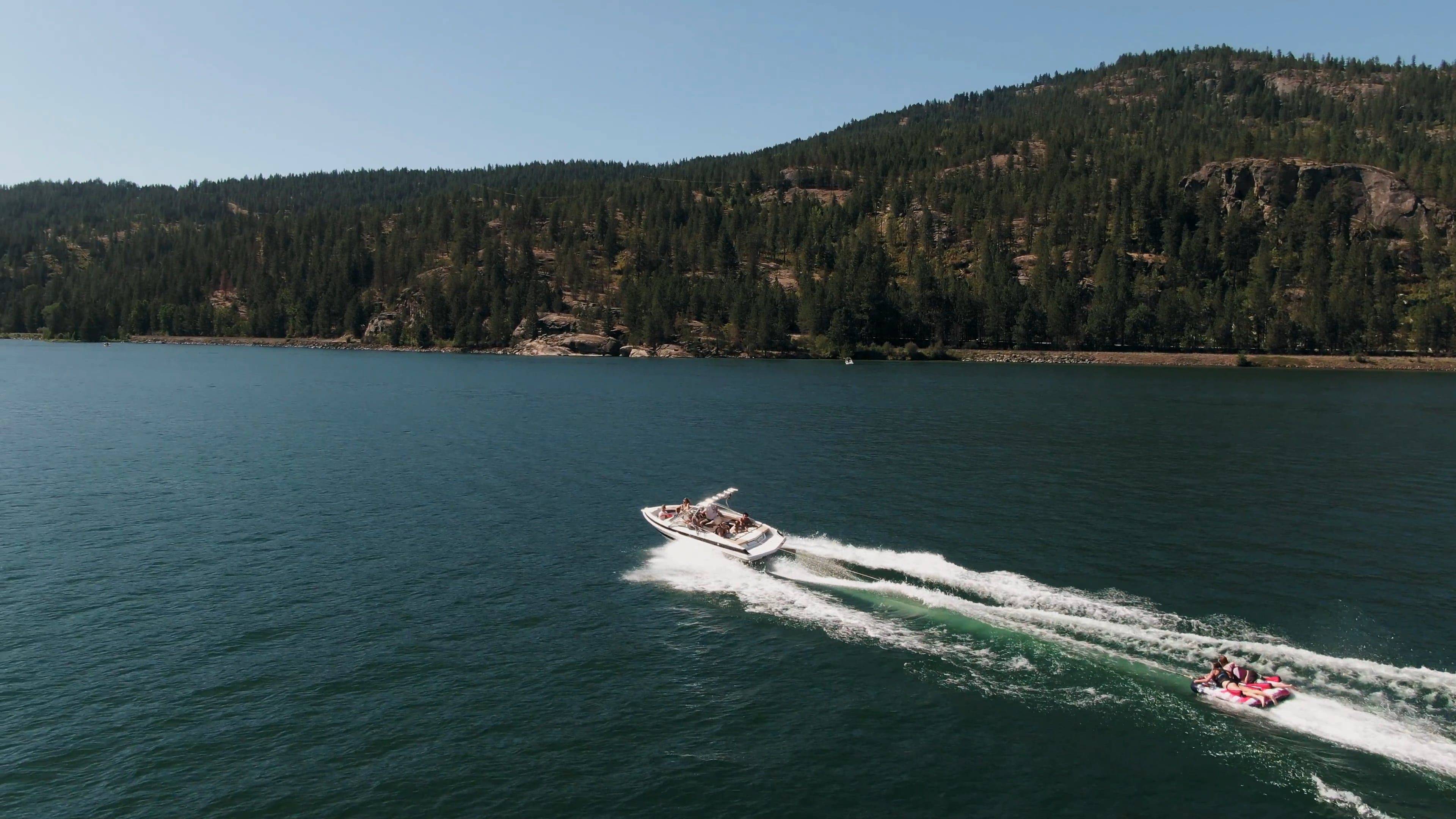 A Speedboat Tugging A Bumper Ride Float · Free Stock Video