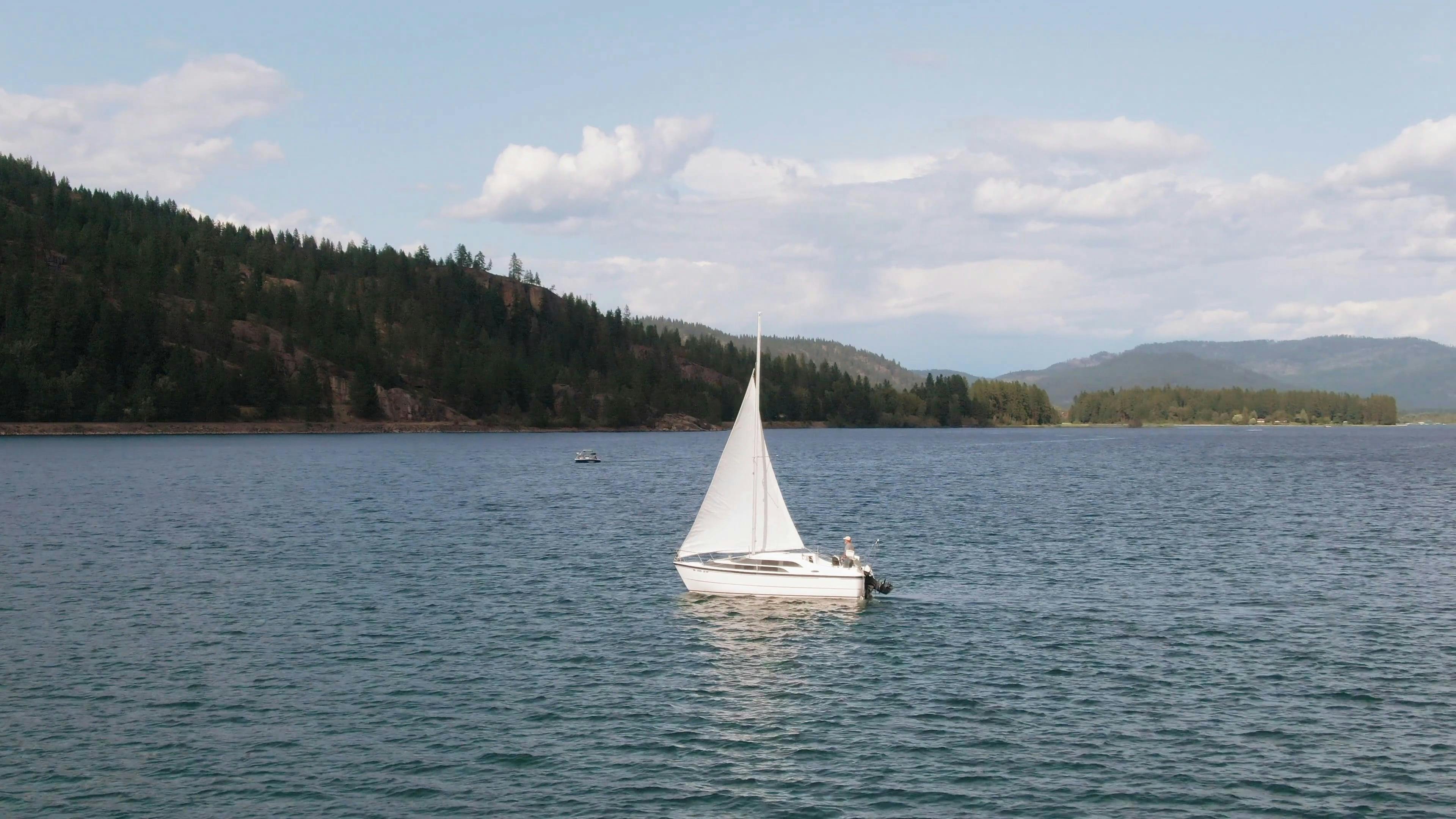 A Sailboat Floating In The Middle Of A Lake Free Stock Video Footage ...