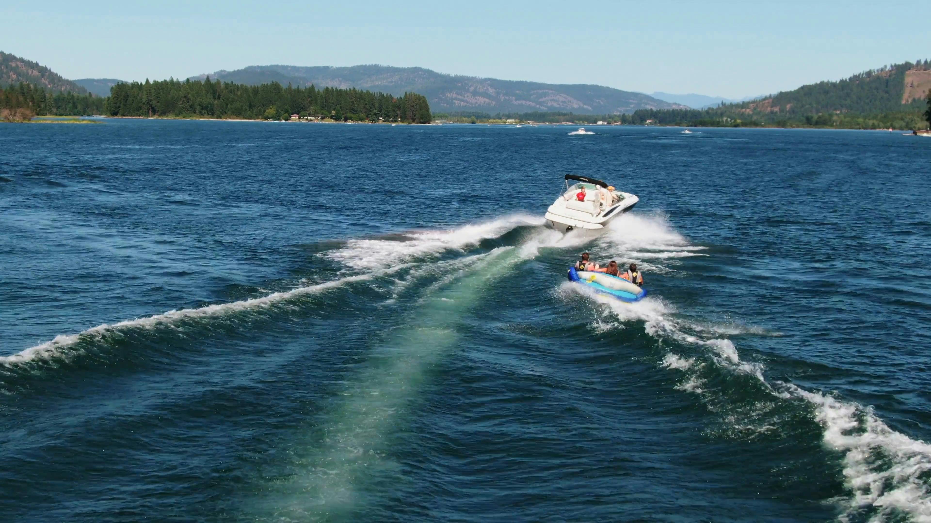 A Bump Ride Float Pulled By A Speedboat · Free Stock Video