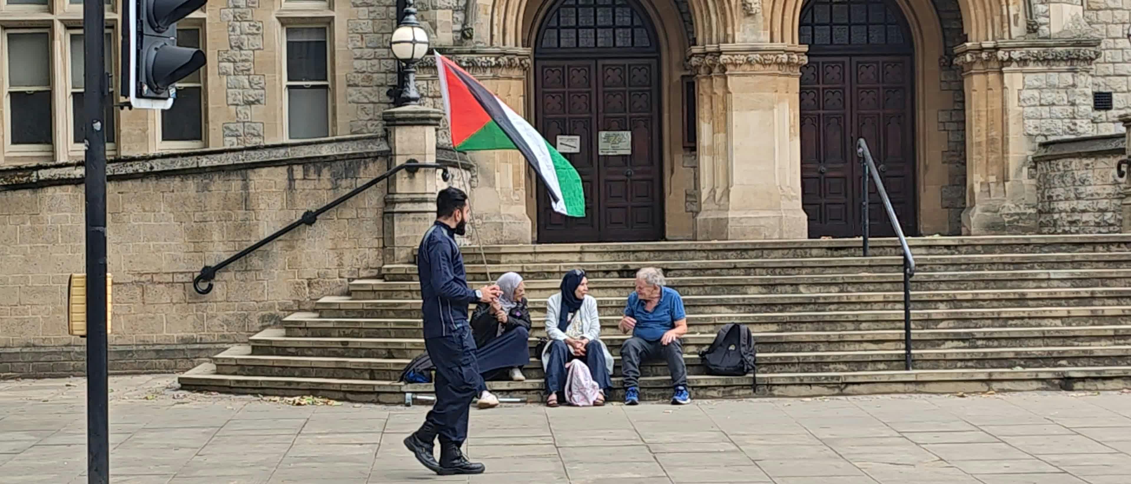 People Talking and waving palestinian Flag in front of Ealing Town Hall ...