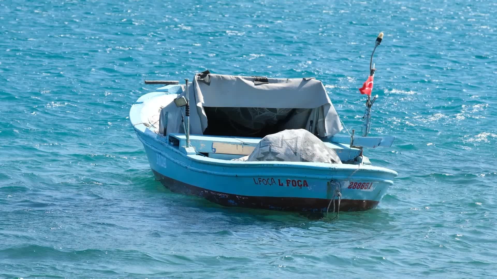 Small Blue Boat Floating on Clear Water Free Stock Video Footage ...