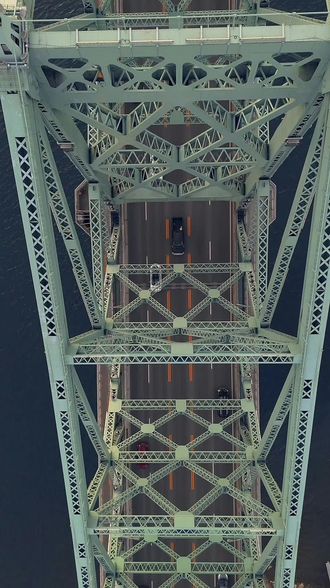 The bridge is a large structure that is in the middle of the water Free ...