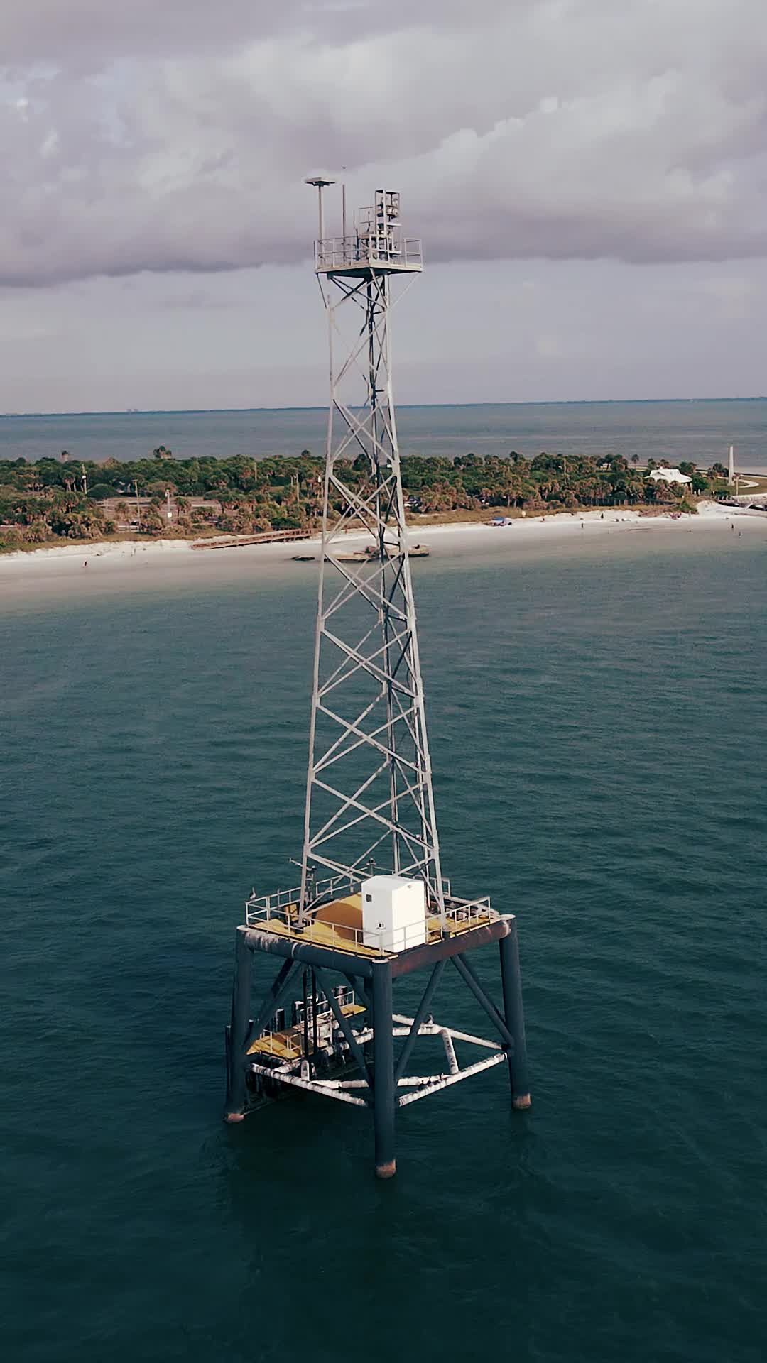 An aerial view of a tower in the ocean Free Stock Video Footage ...