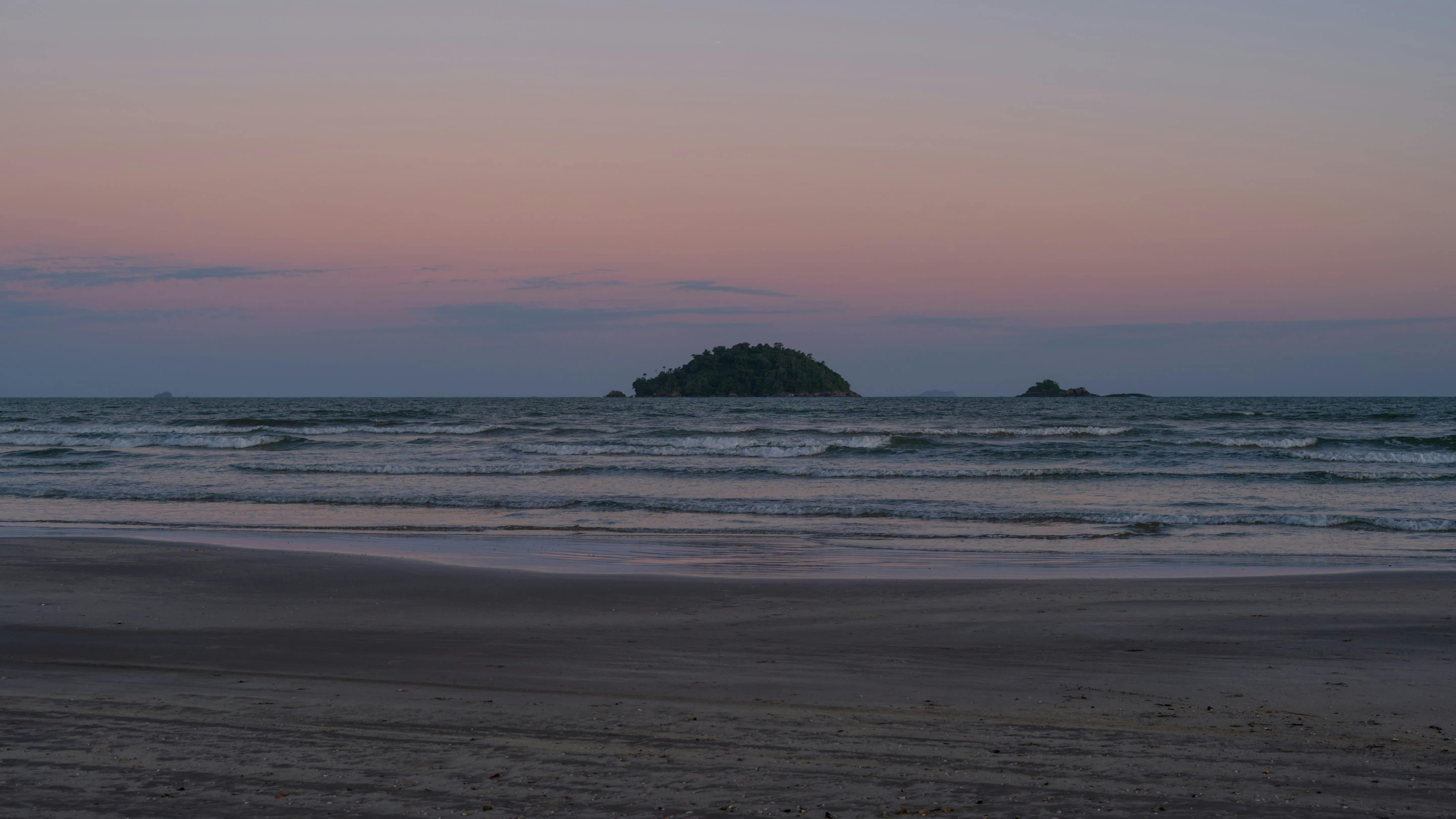 A colorful sky on the beach during nightfall Free Stock Video Footage ...