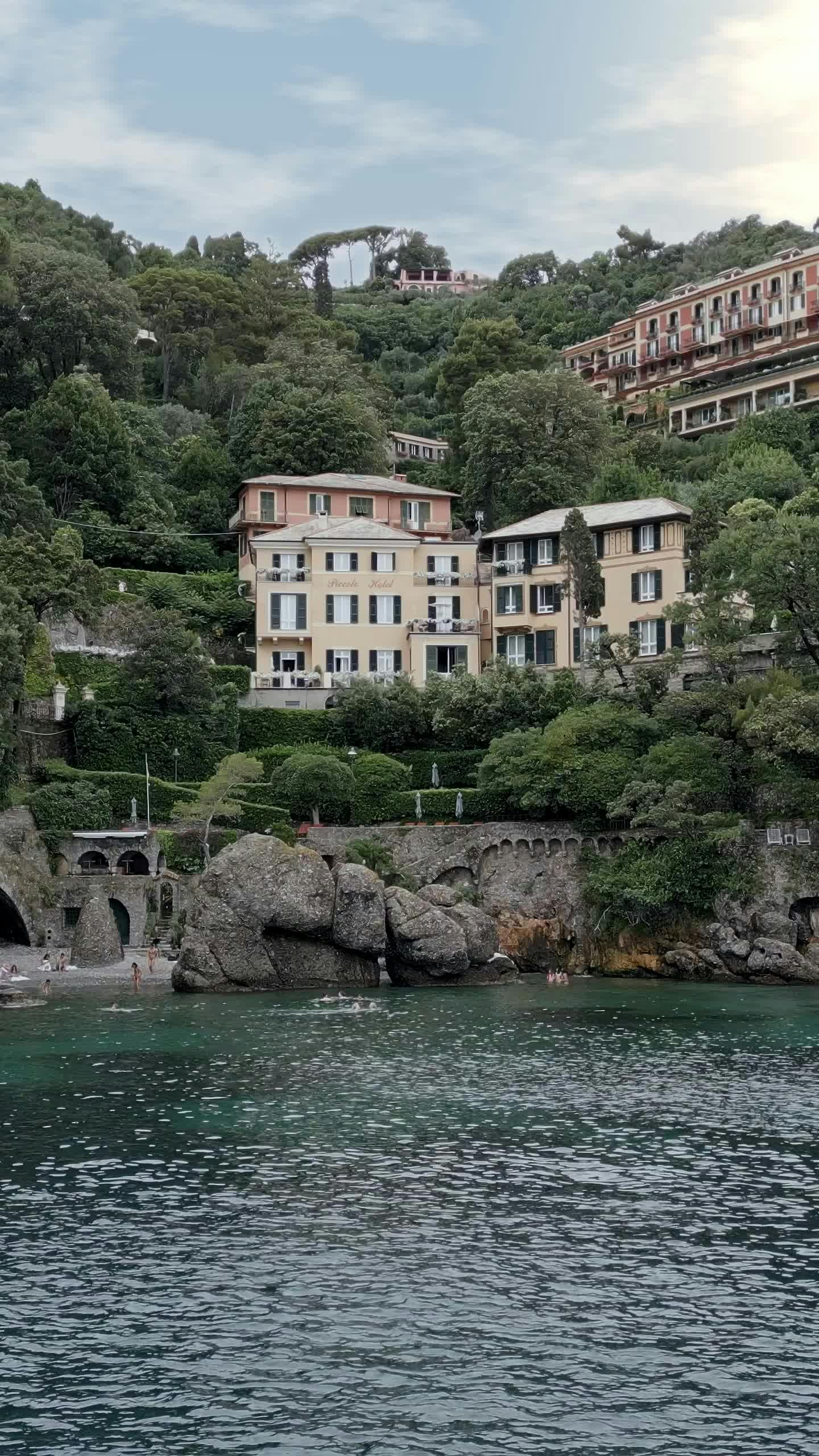 A charming hillside view in Italy features colorful villas nestled ...