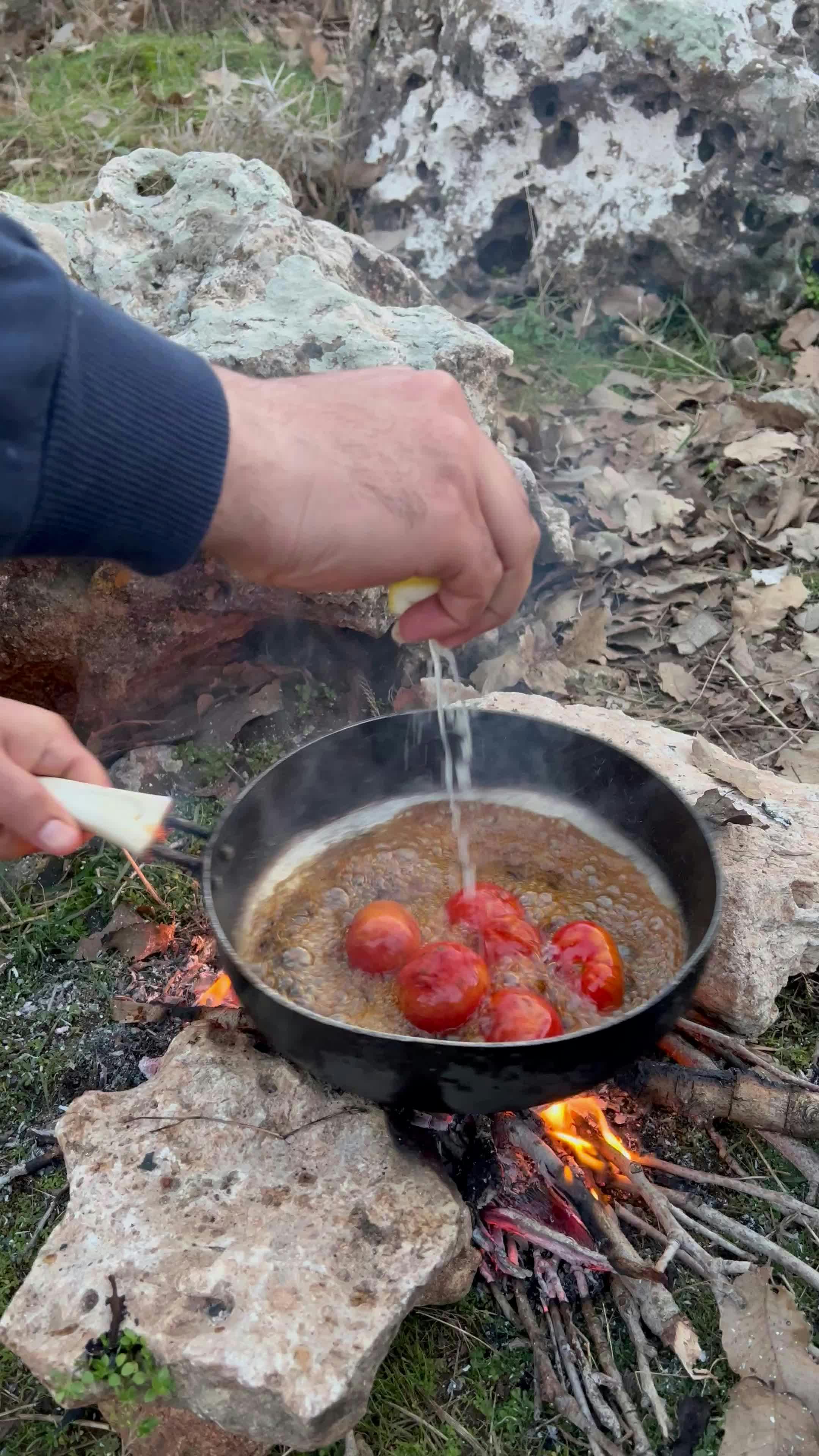 A person cooking food on a campfire Free Stock Video Footage, Royalty ...