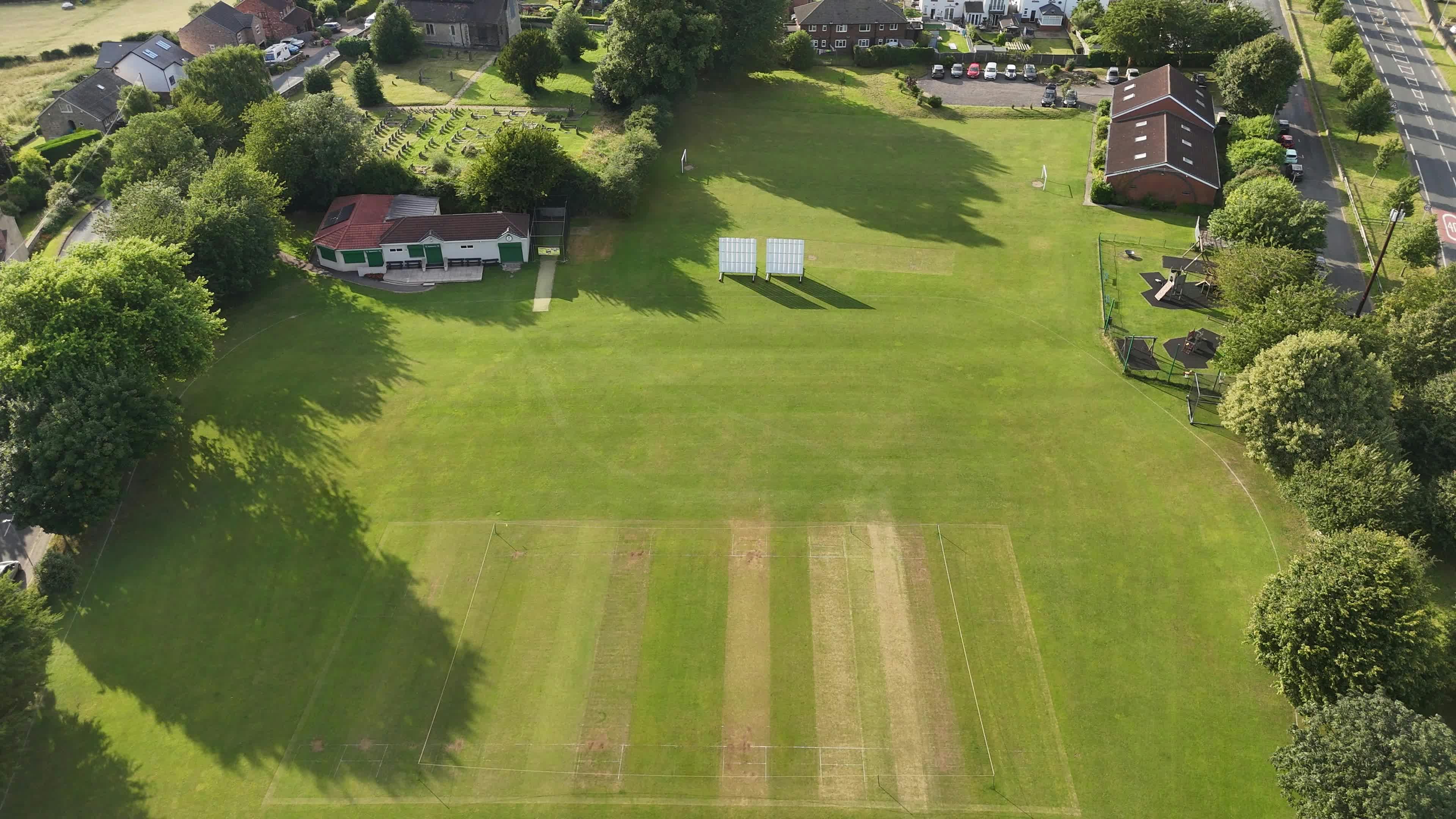 An aerial view of a cricket field with trees Free Stock Video Footage ...