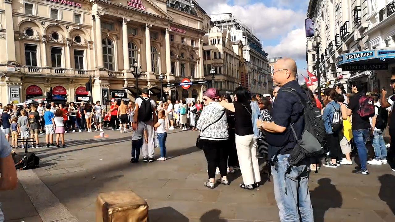 Crowds Of People In The Street Watching Street Performance · Free Stock ...