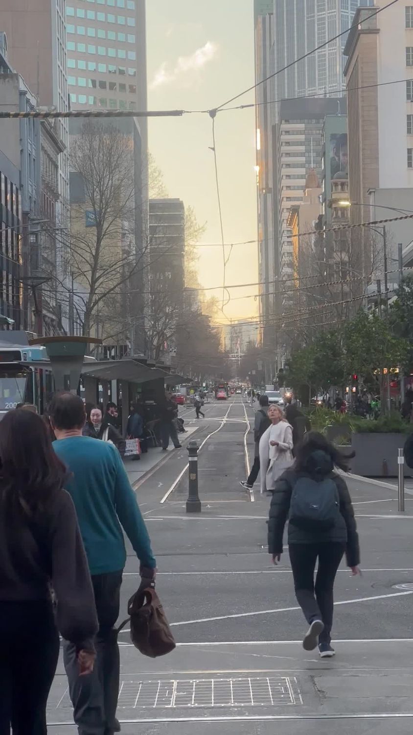 People walking down a city street with buildings in the background Free ...