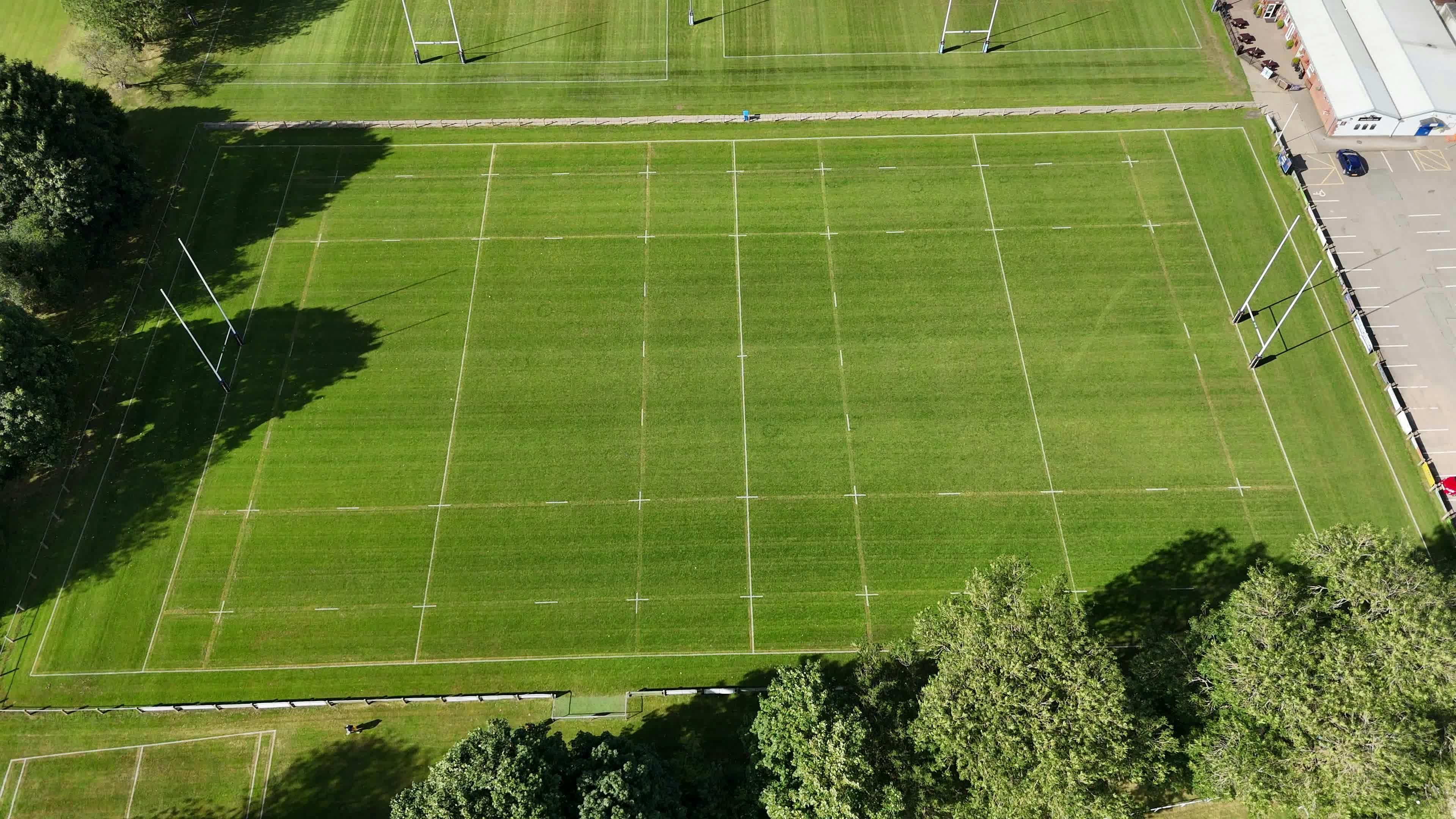 An aerial view of a rugby field with trees Free Stock Video Footage ...
