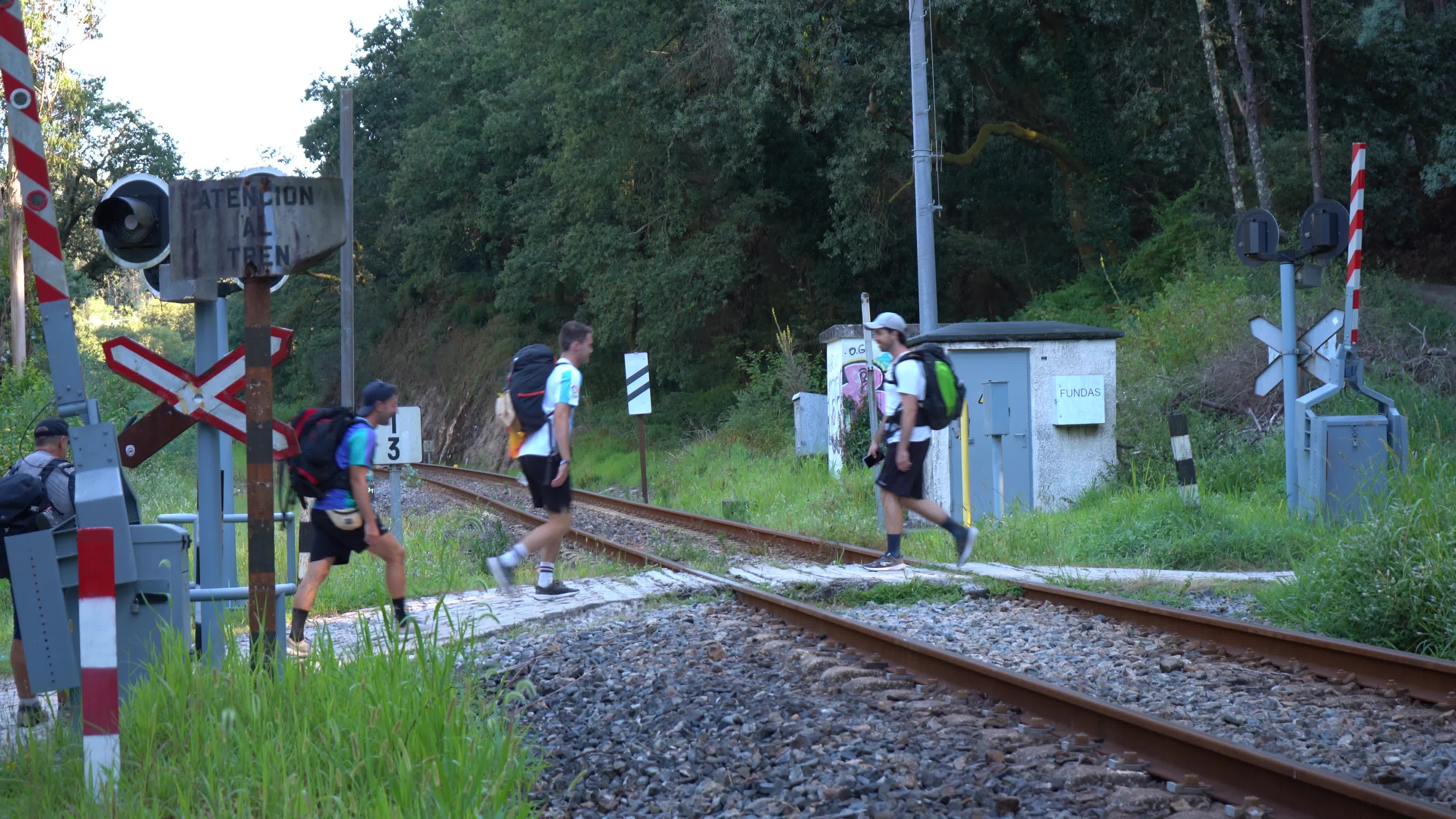 A group of people running on railroad tracks Free Stock Video Footage ...