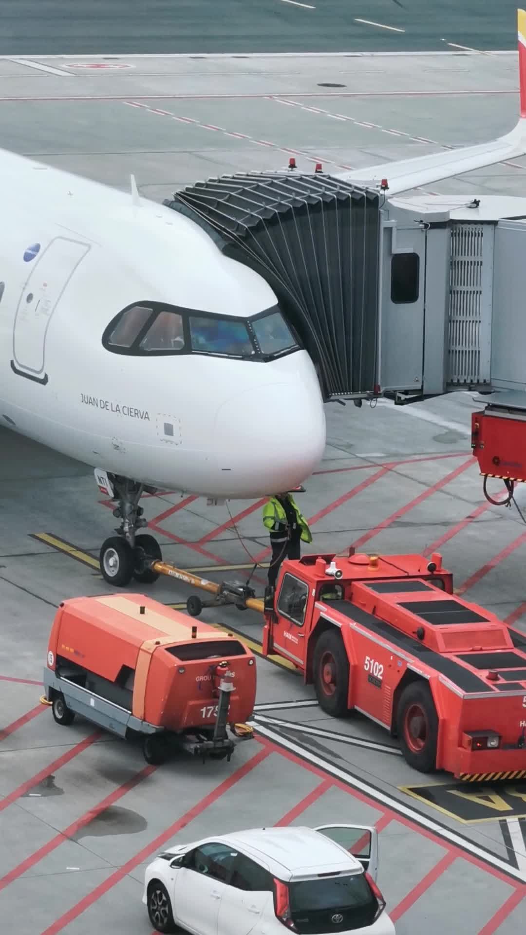 A large airplane is being loaded onto a tarmac Free Stock Video Footage ...
