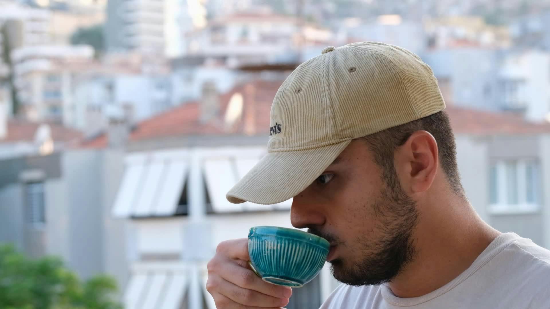 A Young Man Sipping Filter Coffee from a Blue Ceramic Mug Free Stock ...