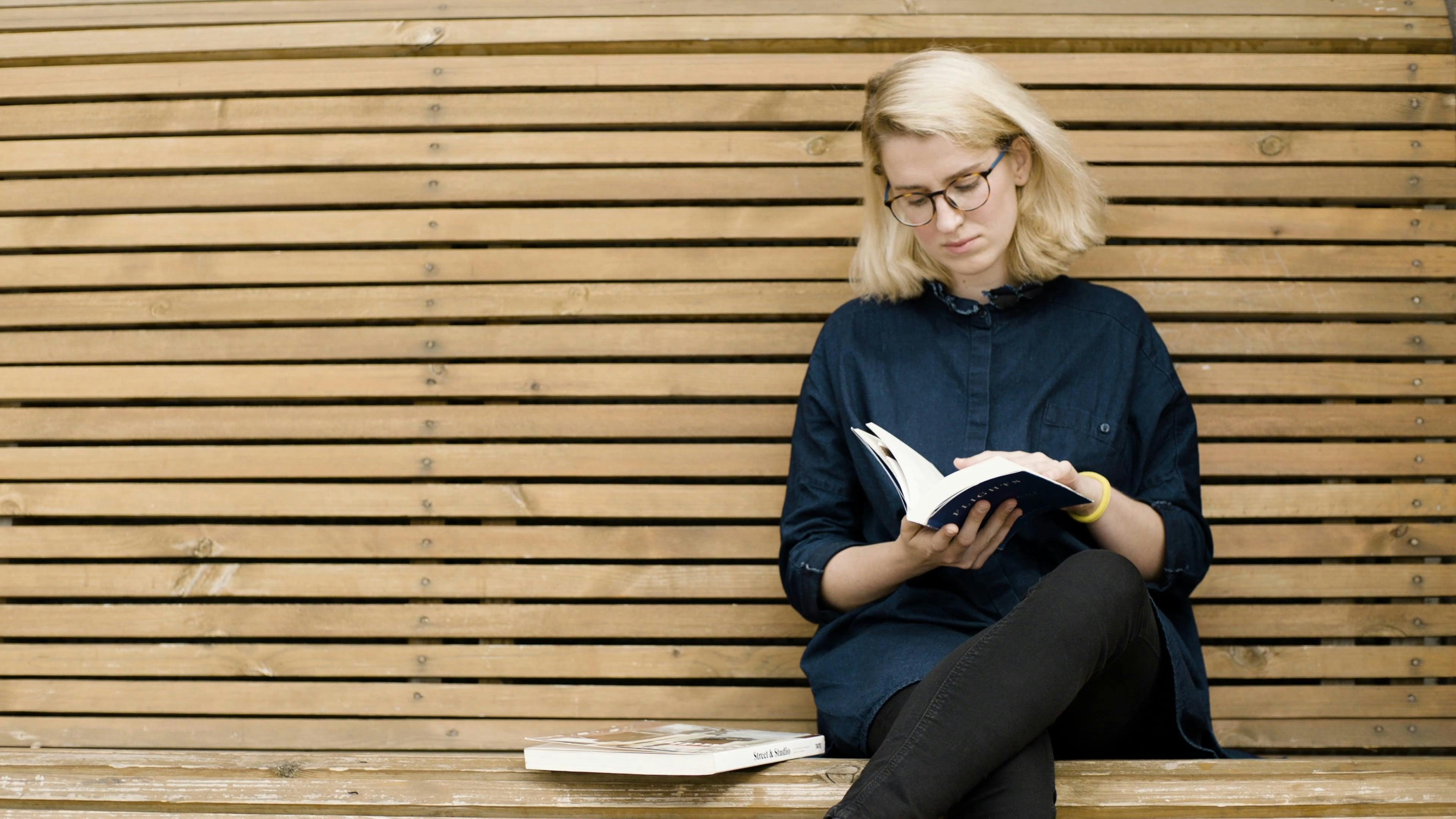 Woman Reading A Book While Waiting · Free Stock Video