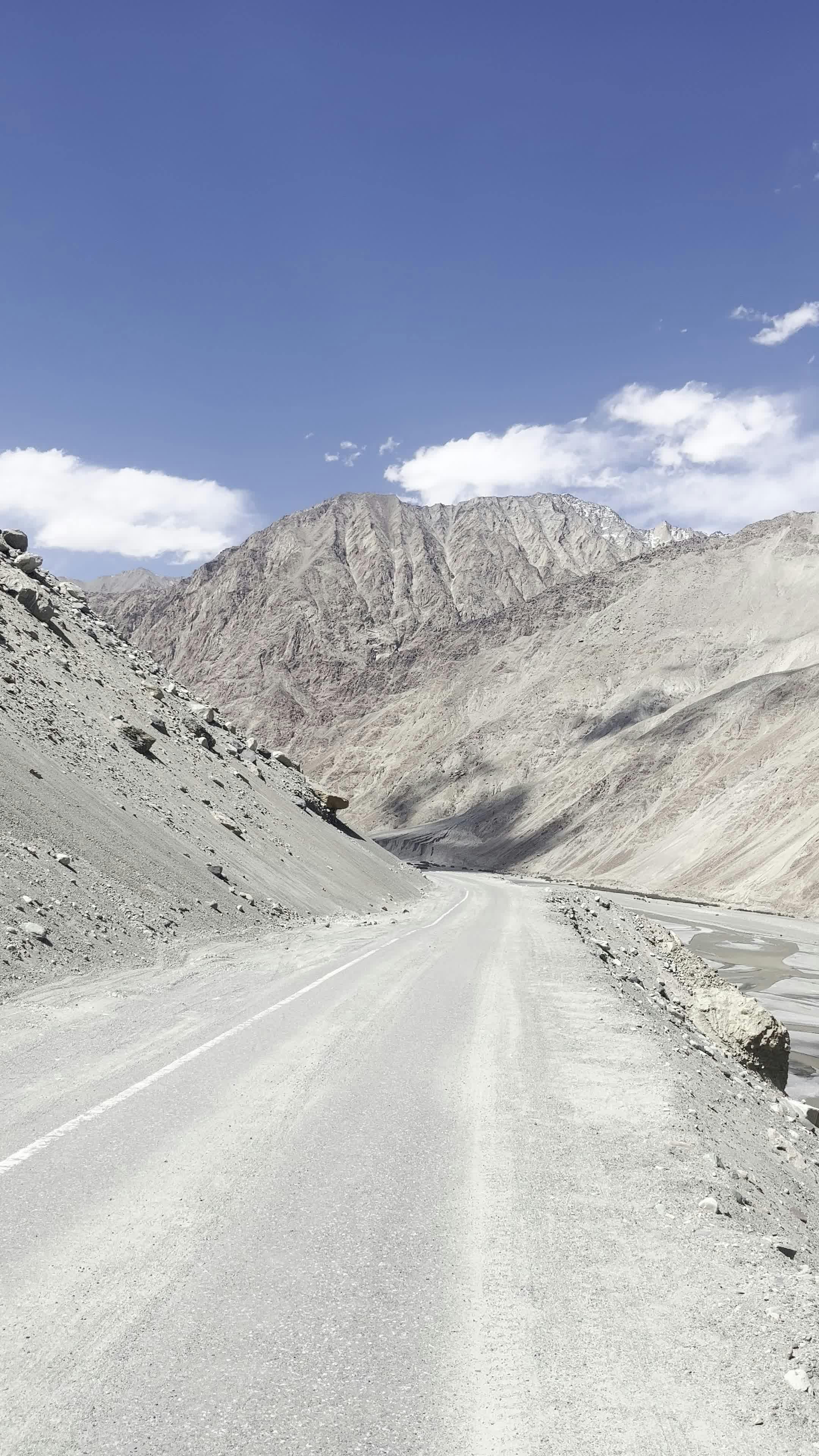 The Kargyak river with the granite mountain peak of Mount Gumbok ...