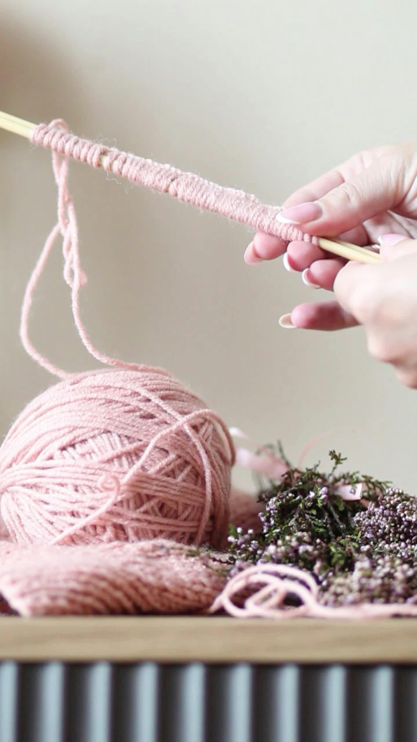 A woman is knitting with yarn and a wooden stick Free Stock Video ...