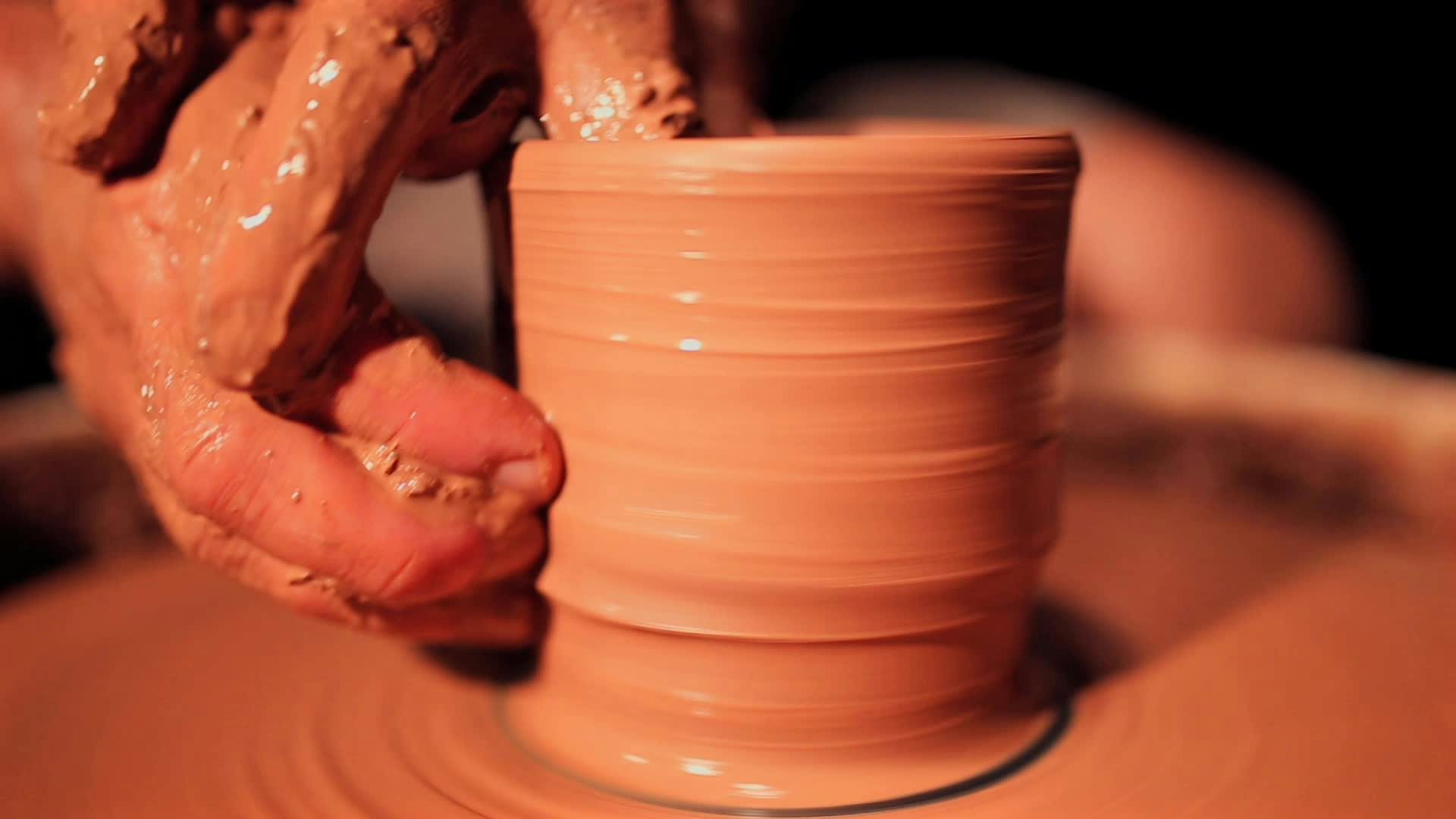 A person is making a pottery on a pottery wheel Free Stock Video ...