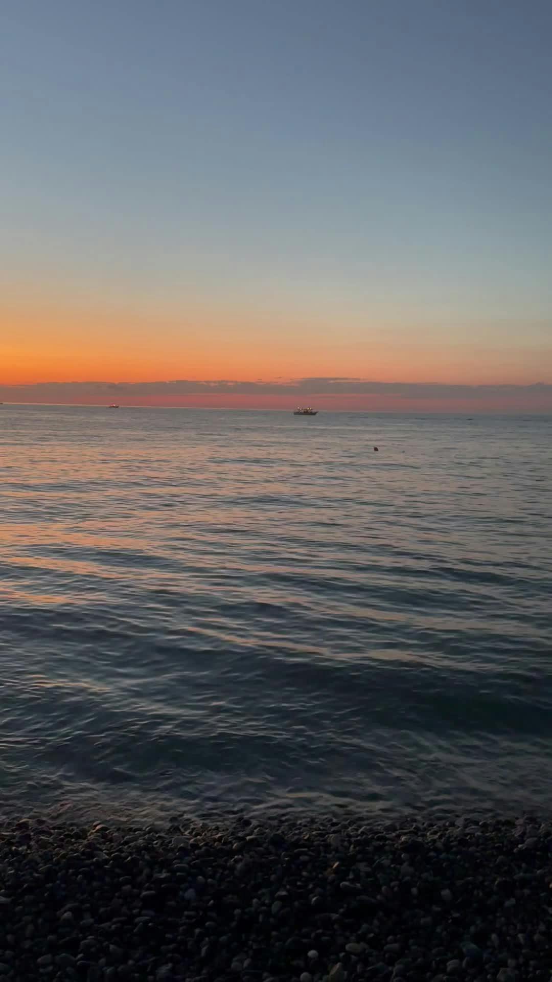 The sun sets over the ocean and a beach Free Stock Video Footage, Royalty-Free 4K & HD Video Clip