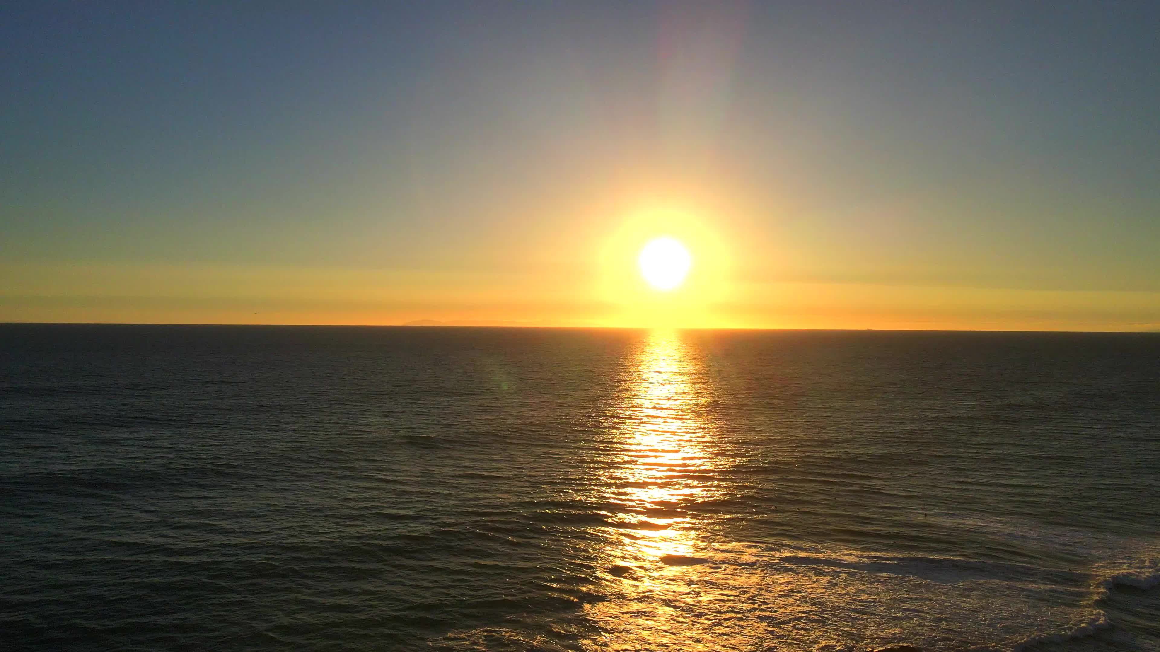 The sun rising over the ocean from a beach Free Stock Video Footage ...