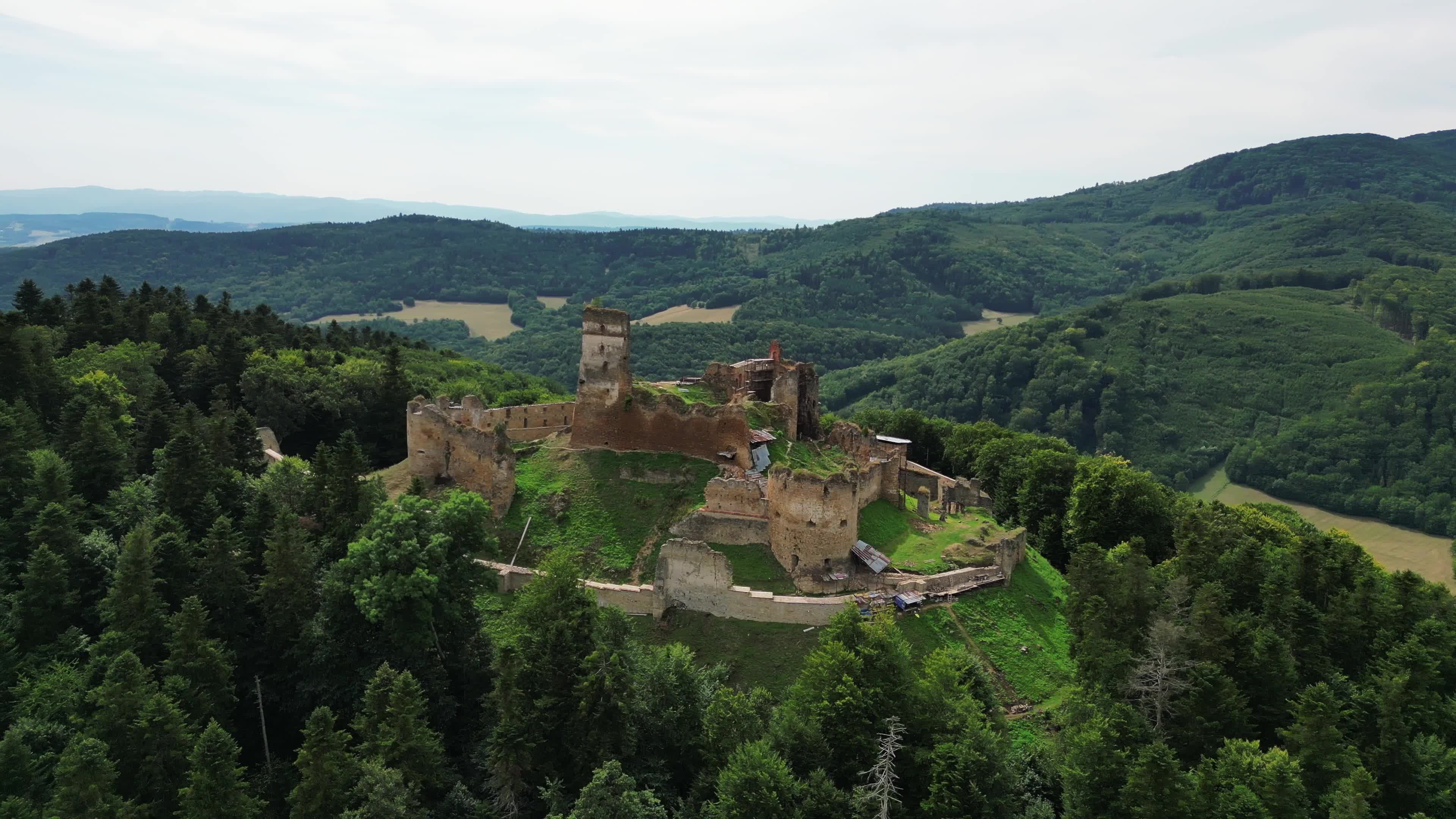 An aerial view of a castle in the middle of a forest Free Stock Video ...