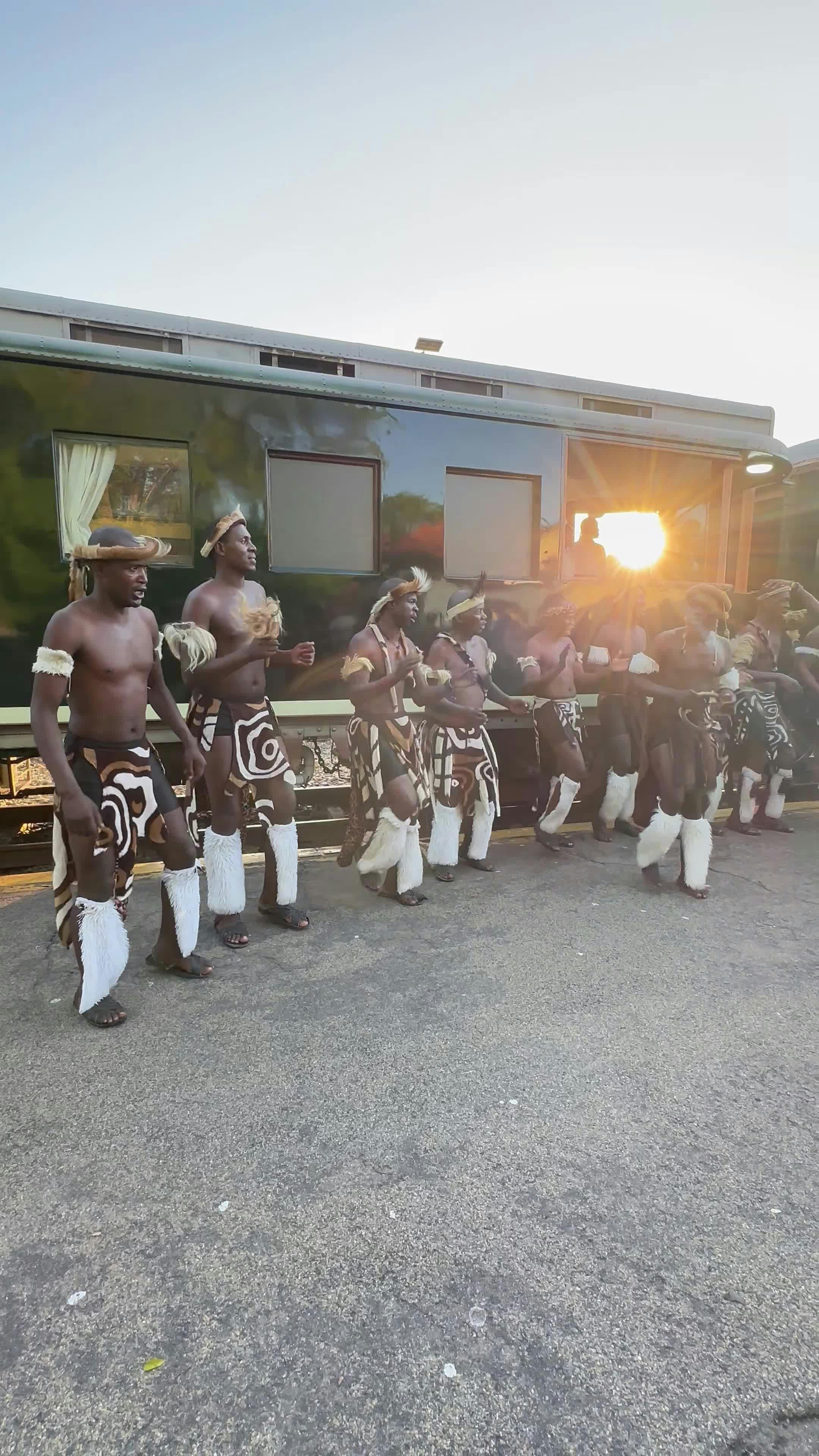 A Group Of Performers Performing Traditional African Music And Dances ...