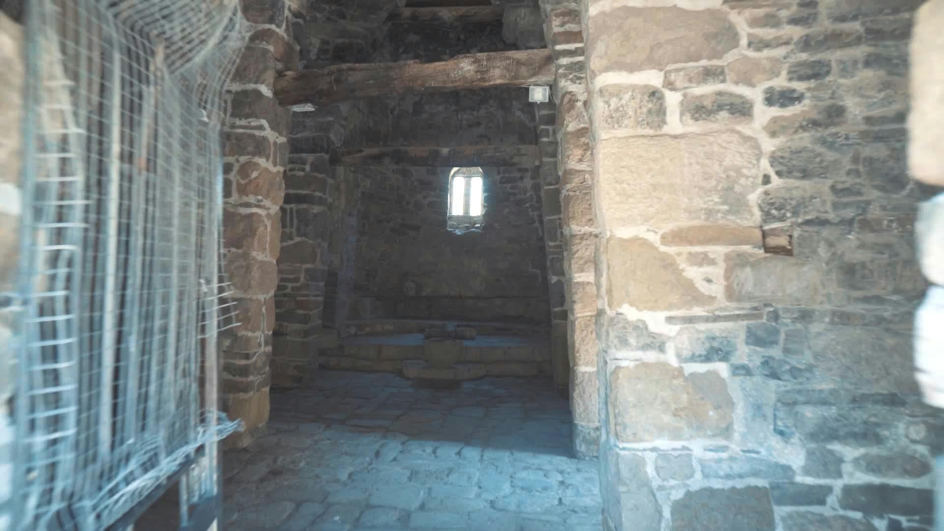 A stone room with a stone bench and a stone wall Free Stock Video ...