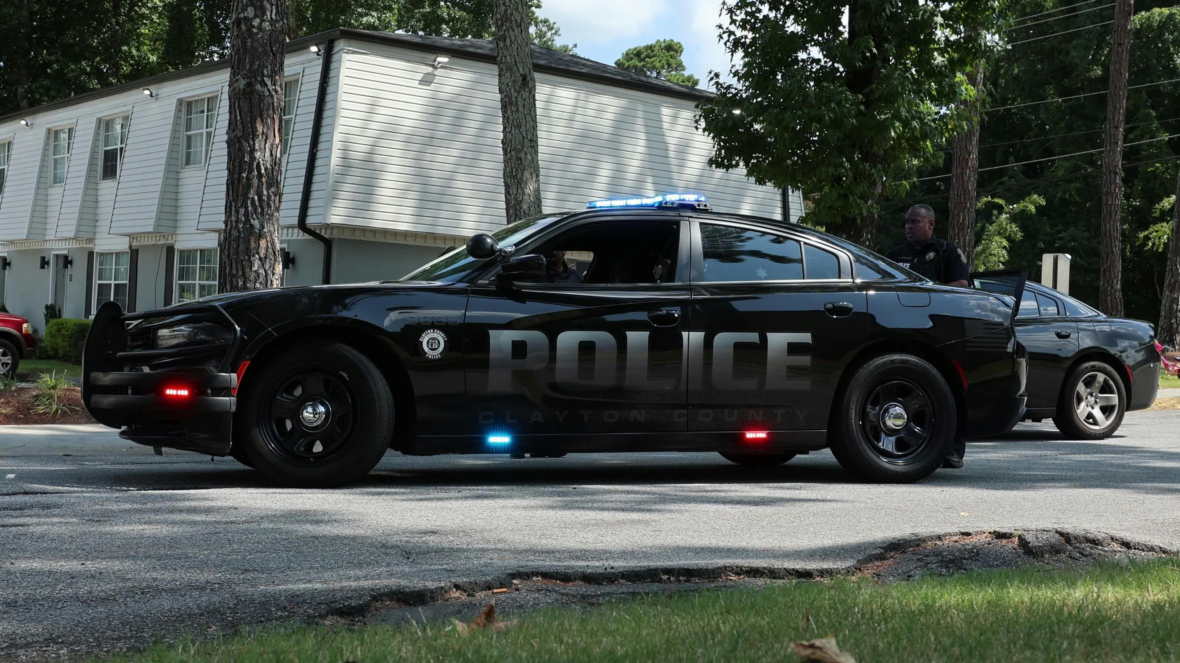 A Police Officer Getting Inside of a Police Car Free Stock Video ...