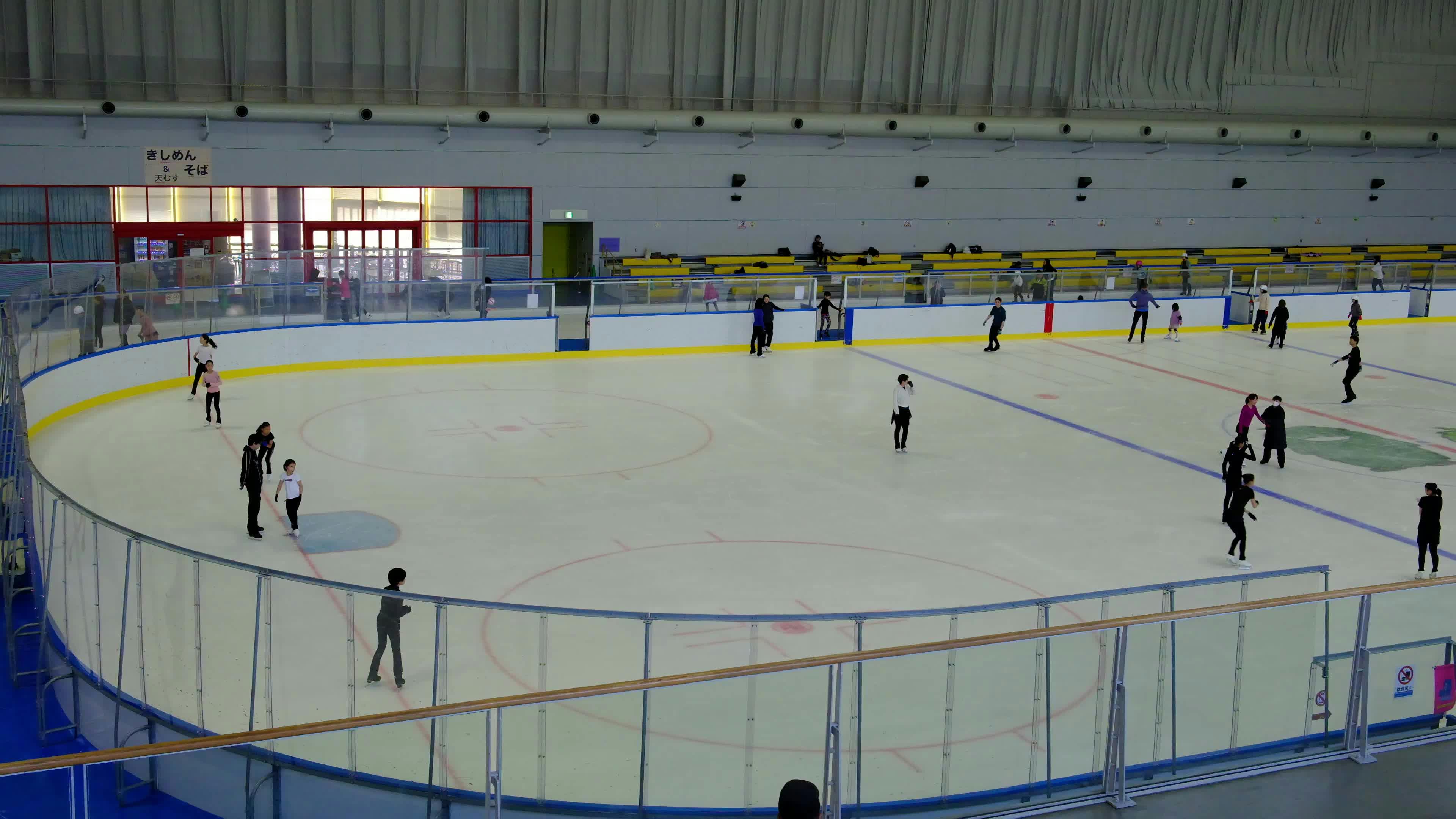People are skating on an ice rink in an indoor arena Free Stock Video ...