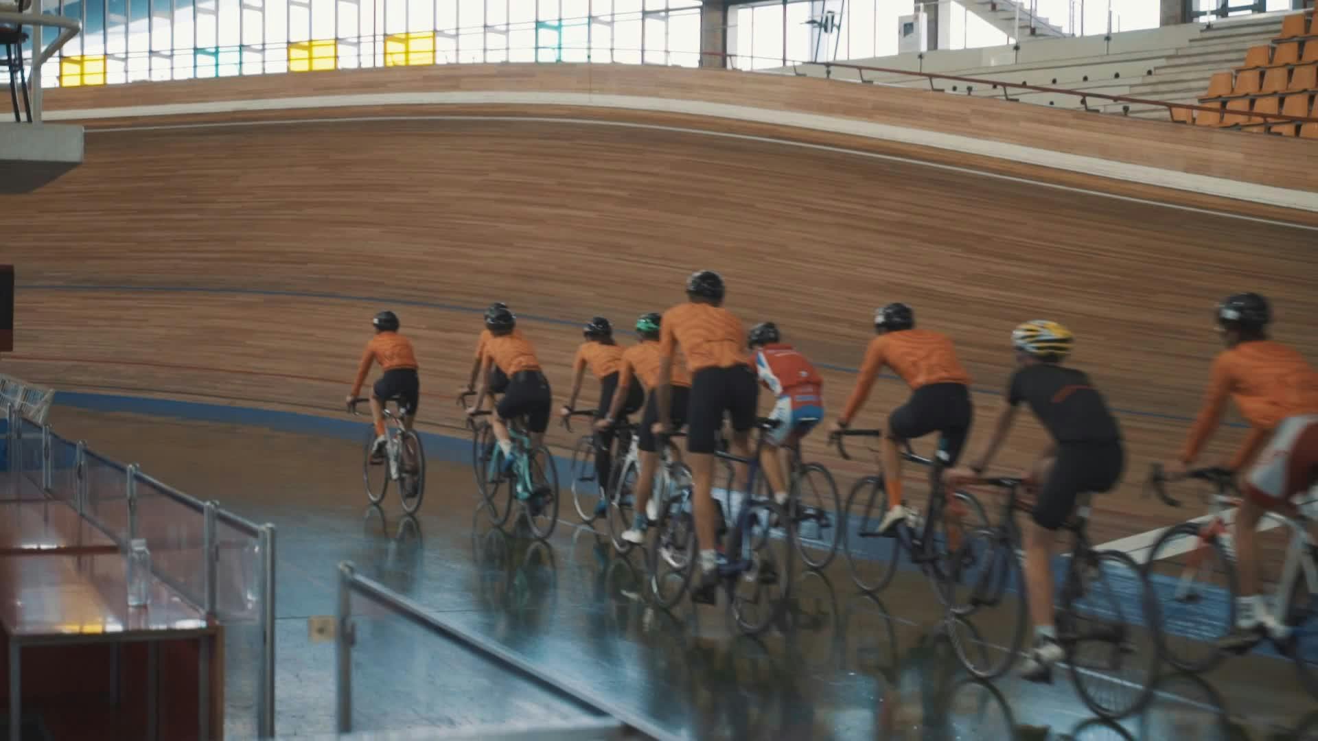 A group of cyclists riding in an indoor track Free Stock Video Footage ...