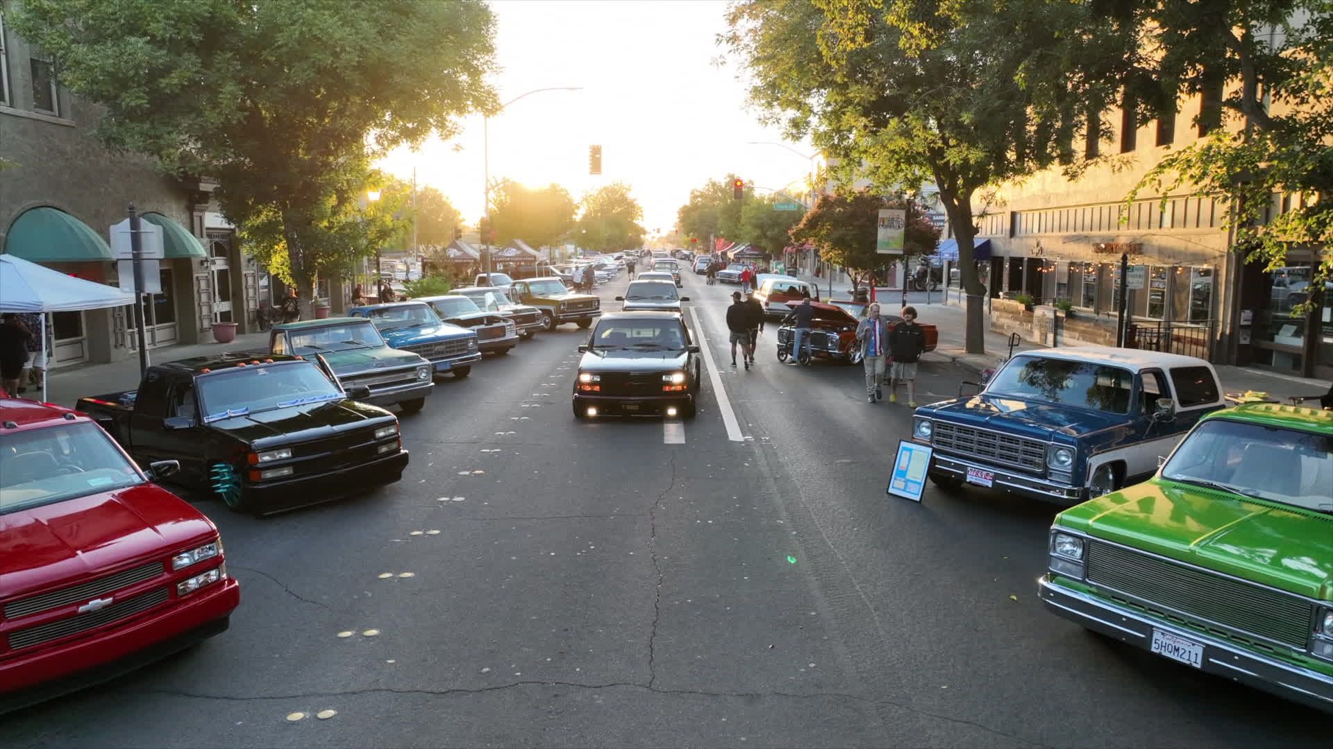 A street with many classic cars parked on it Free Stock Video Footage ...