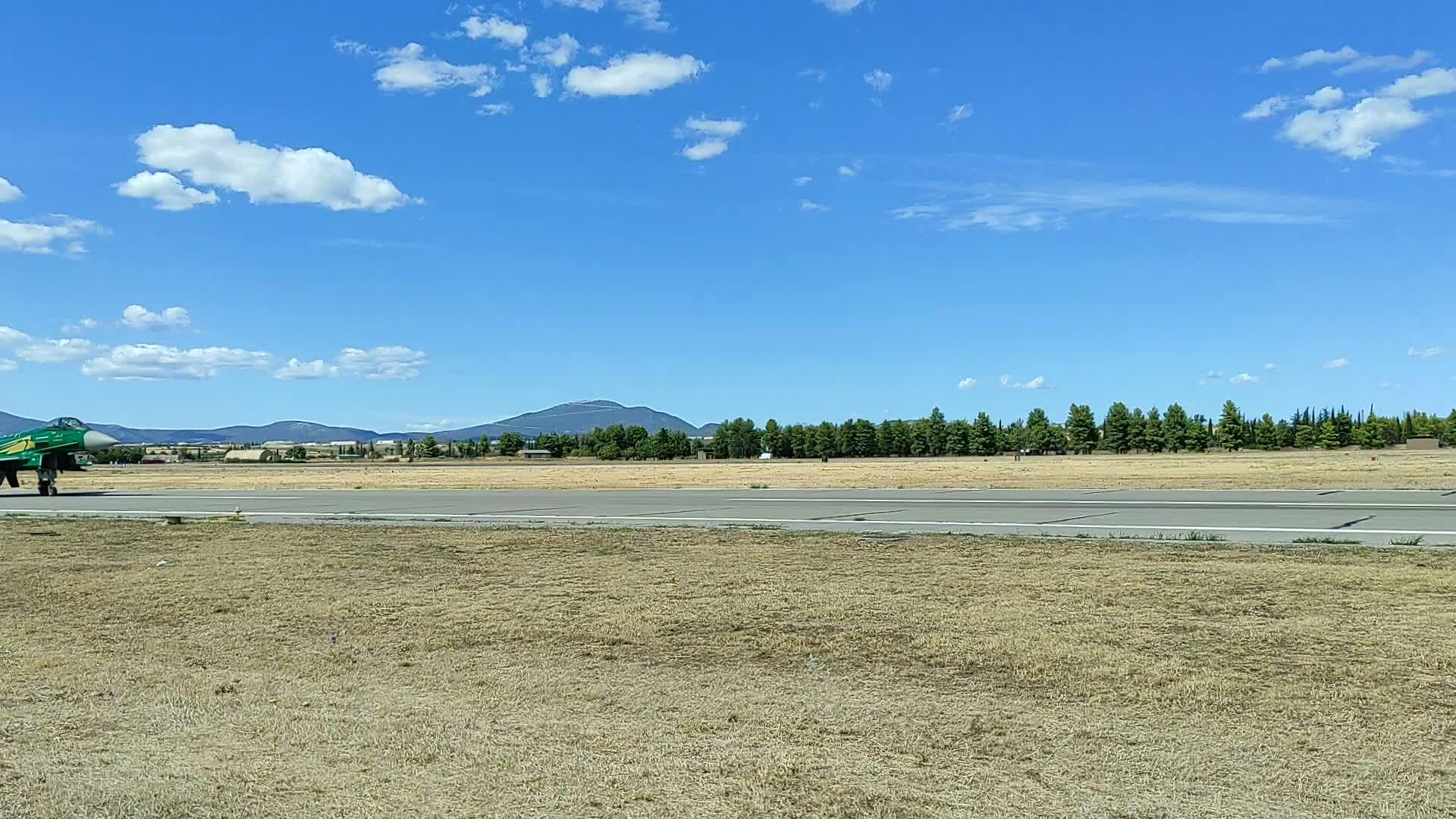 A green fighter jet sitting on the runway Free Stock Video Footage ...