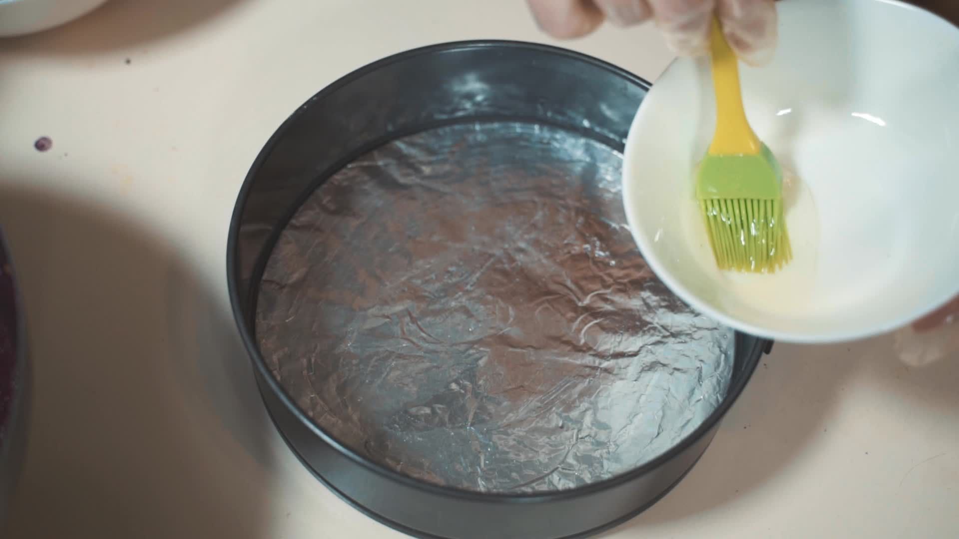 A person is using a spatula to stir a cake Free Stock Video Footage ...