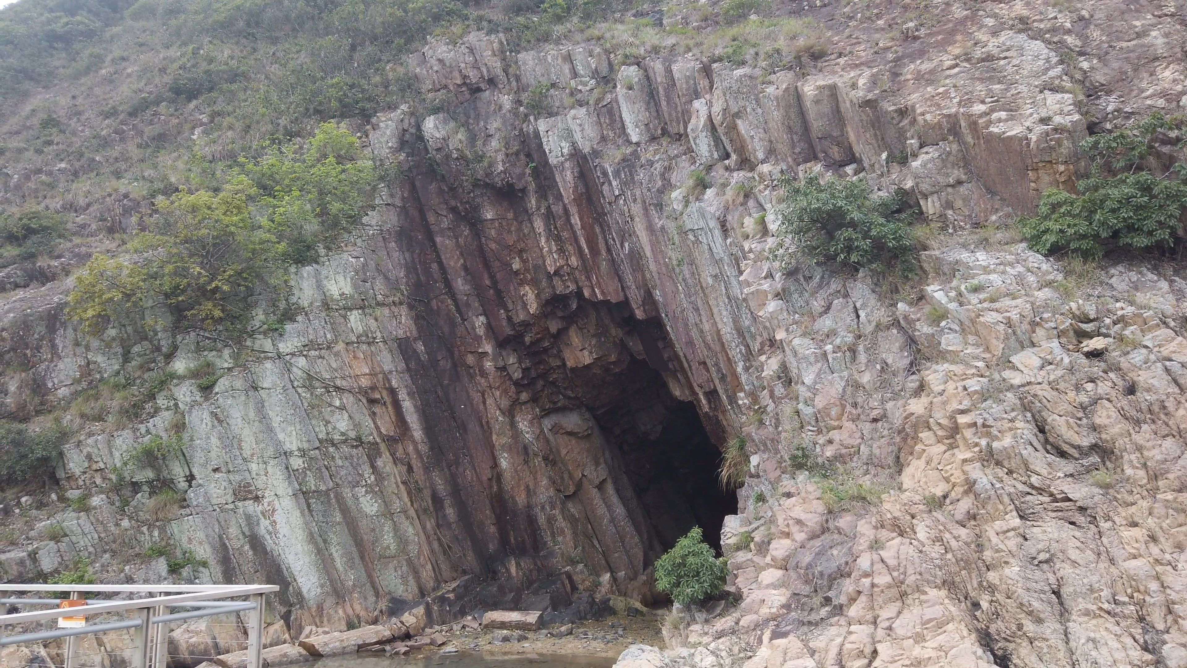 A Large Cave On A Cliff Of A Rocky Mountain Free Stock Video Footage ...