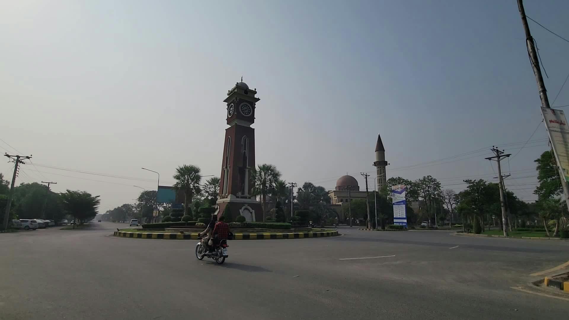 Clock Tower in City Intersection with Busy Traffic Free Stock Video ...